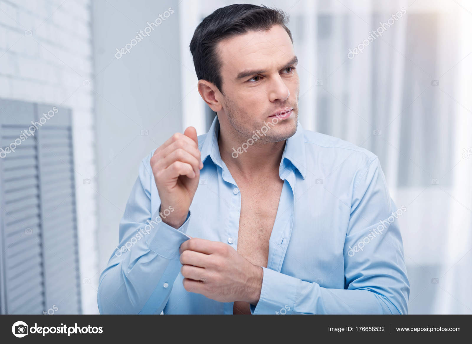 Attractive charming man dressing Stock Photo by ©yacobchuk1 176658532