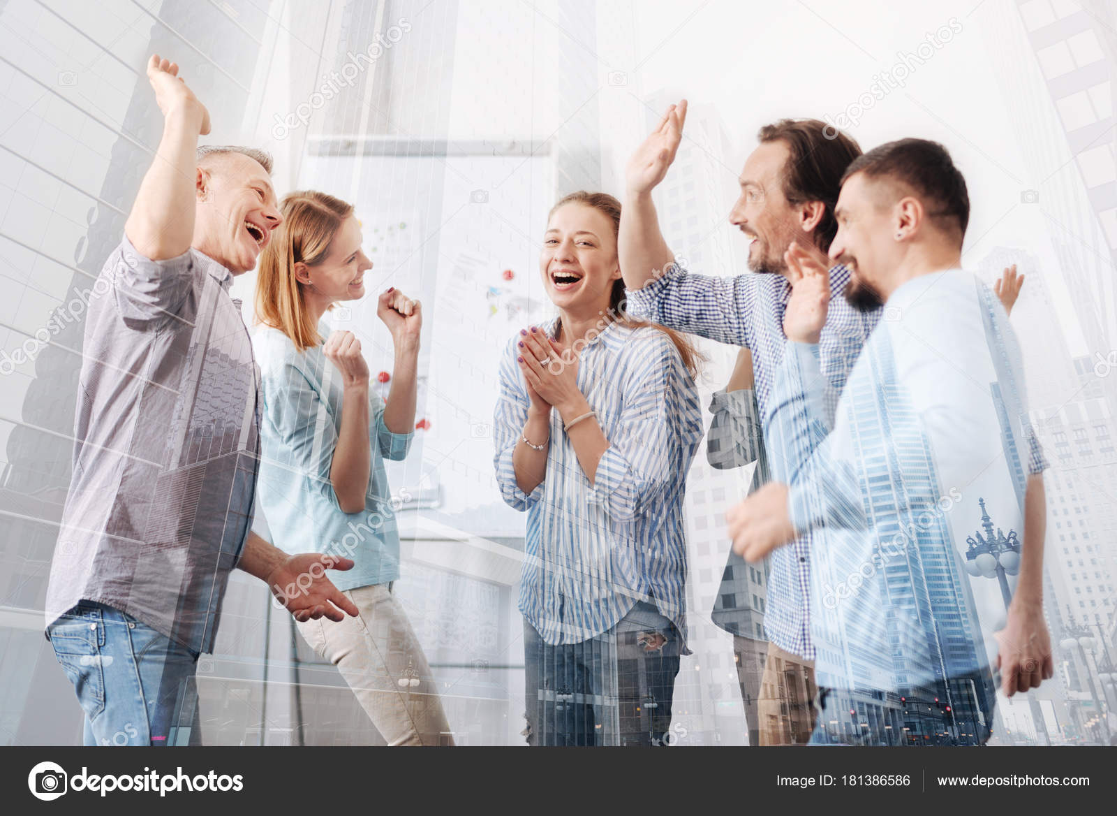 Cheerful colleagues celebrating a successful project together Stock ...