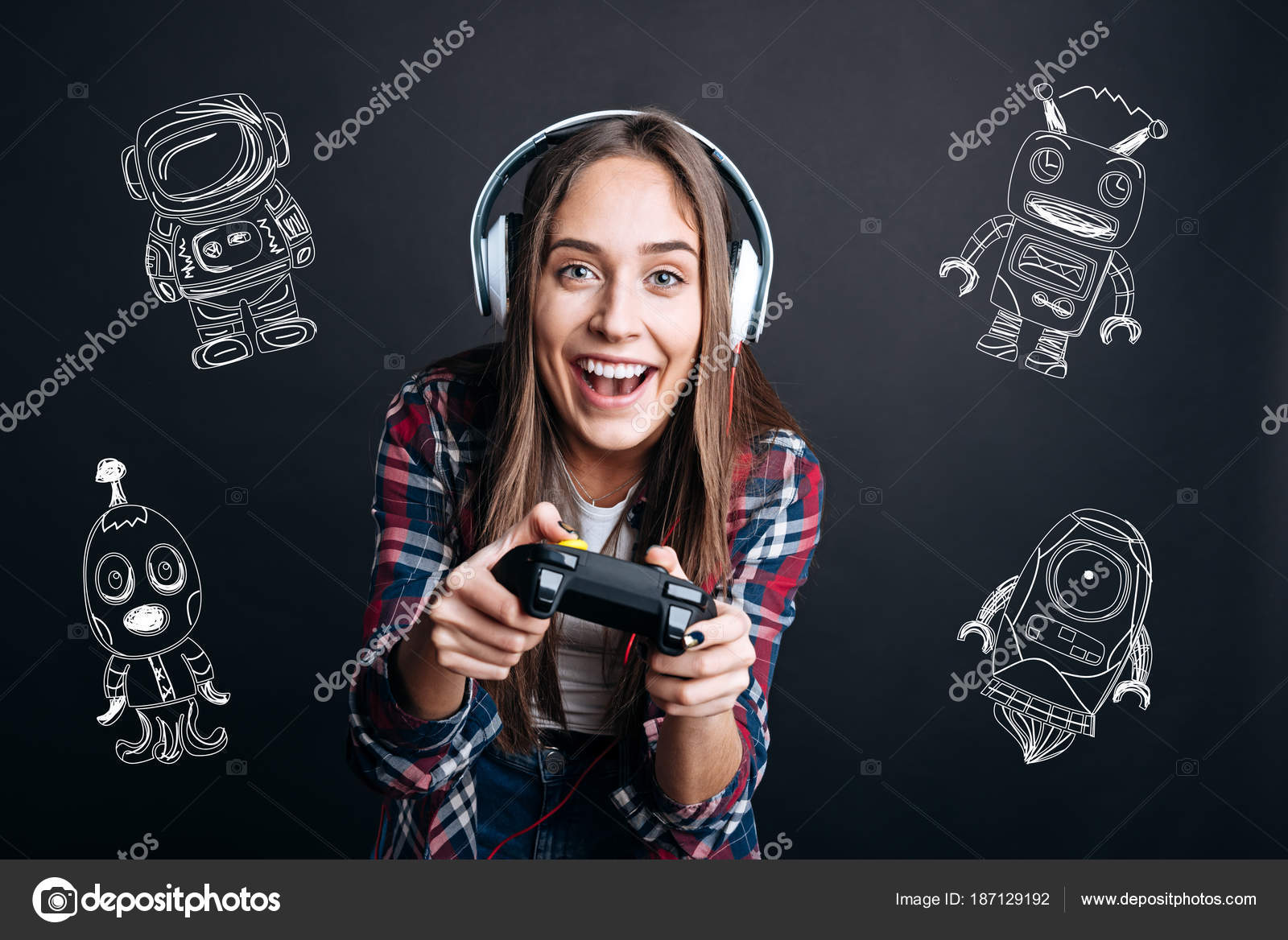 Enthusiastic young woman playing computer games and feeling happy ...