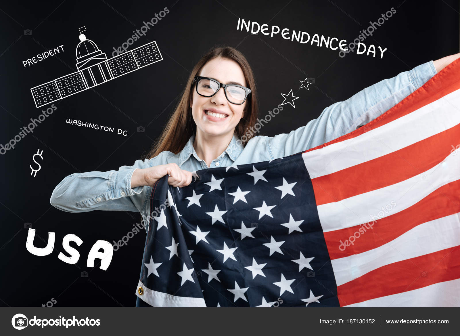 Patriotic student holding a flag of the USA while celebrating ...