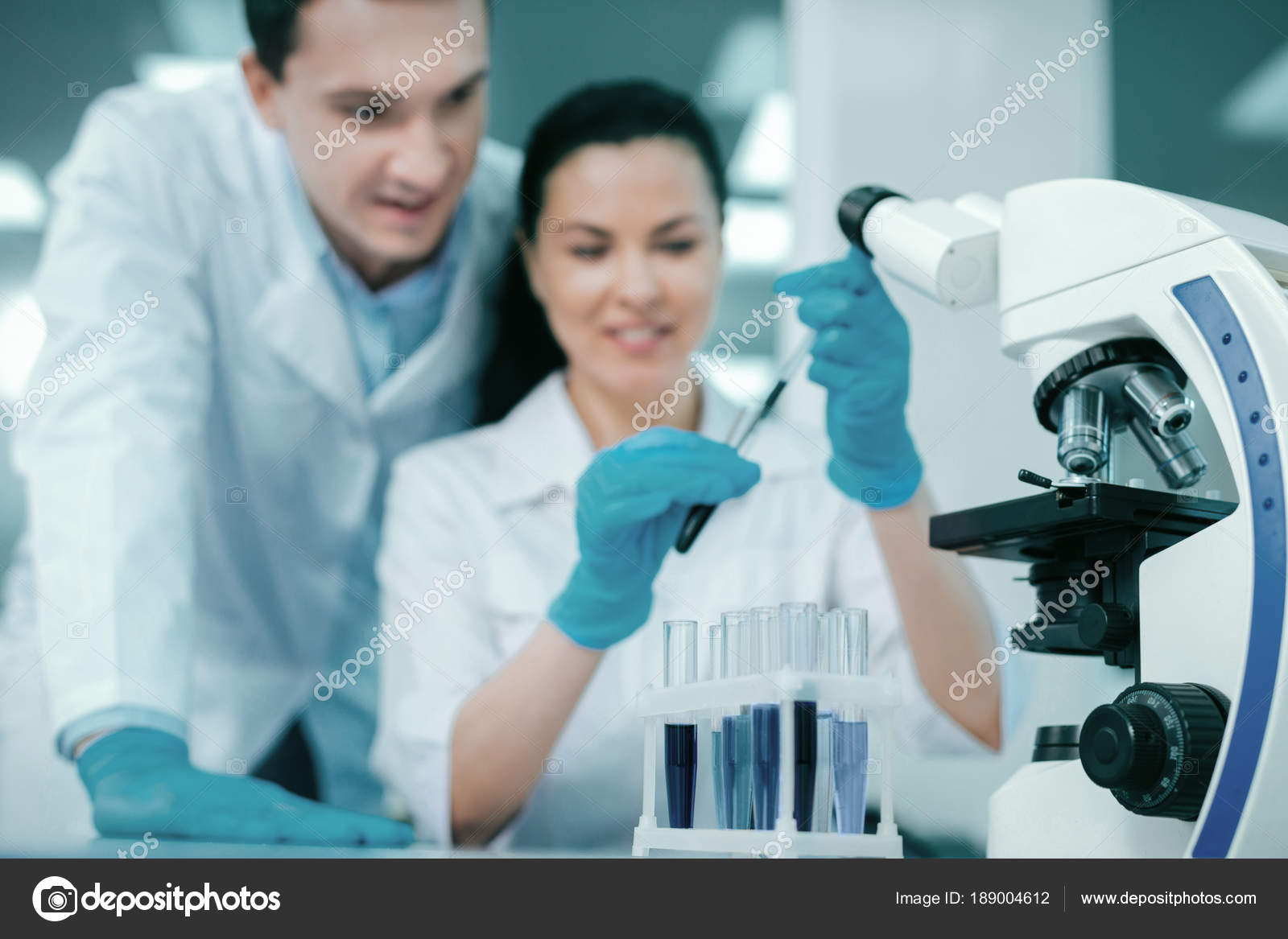 Positive delighted colleagues doing experiment — Stock Photo ...