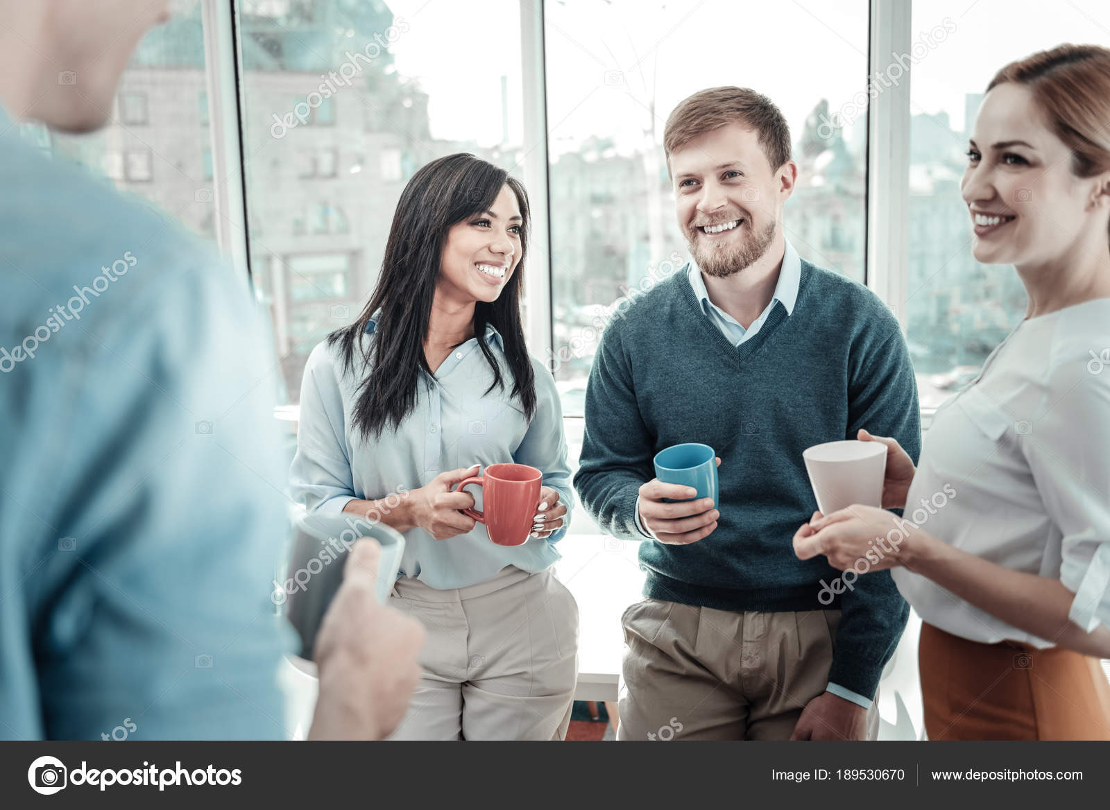 Funny friendly employees smiling and spending time together. Stock ...