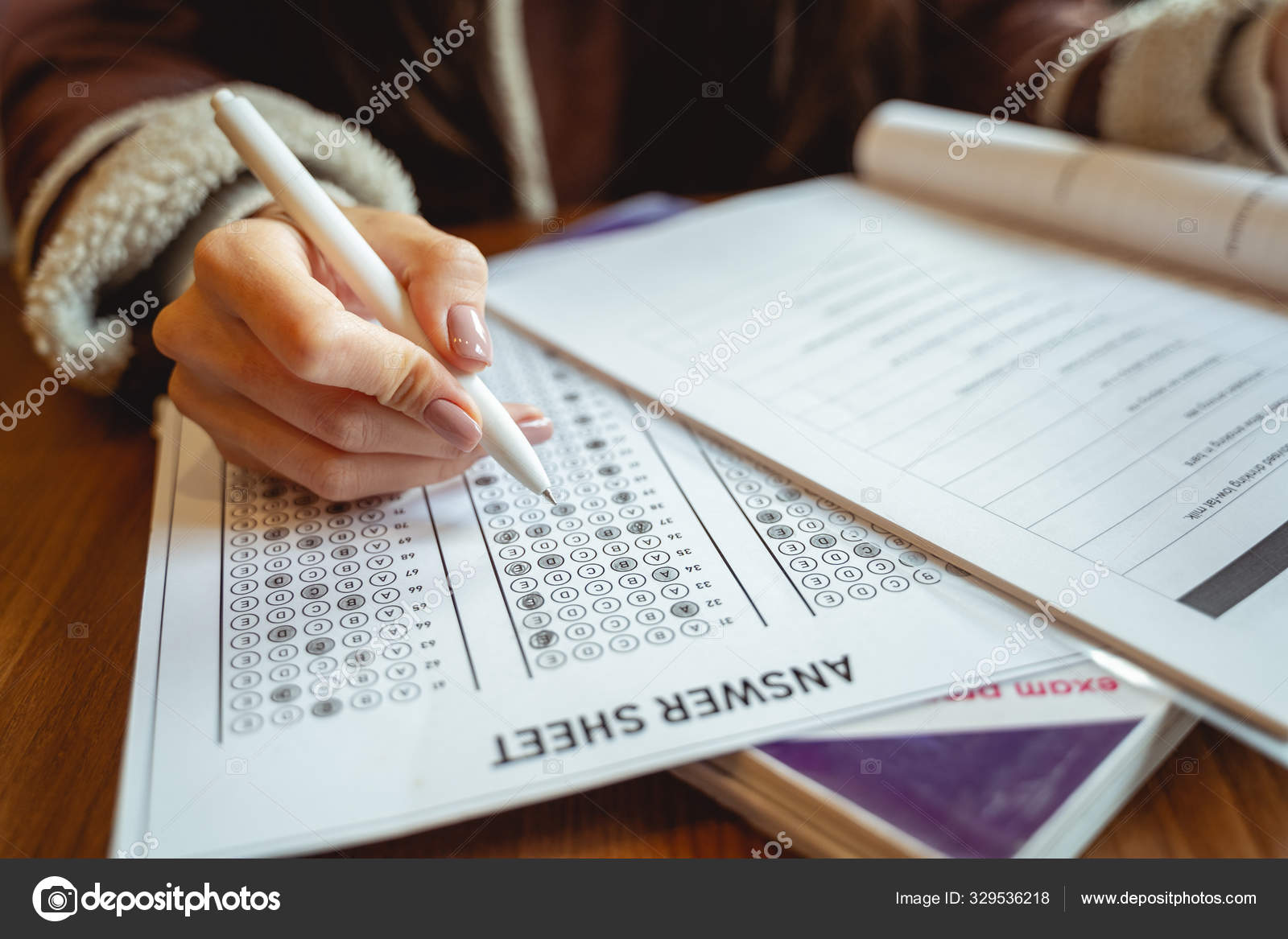 Young female person completing task before exams — Stock Photo ...