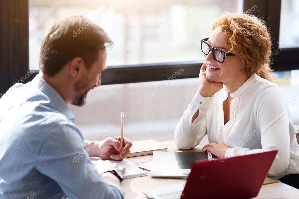 Middle-aged couple working on laptop and taking notes — Stock Photo ...