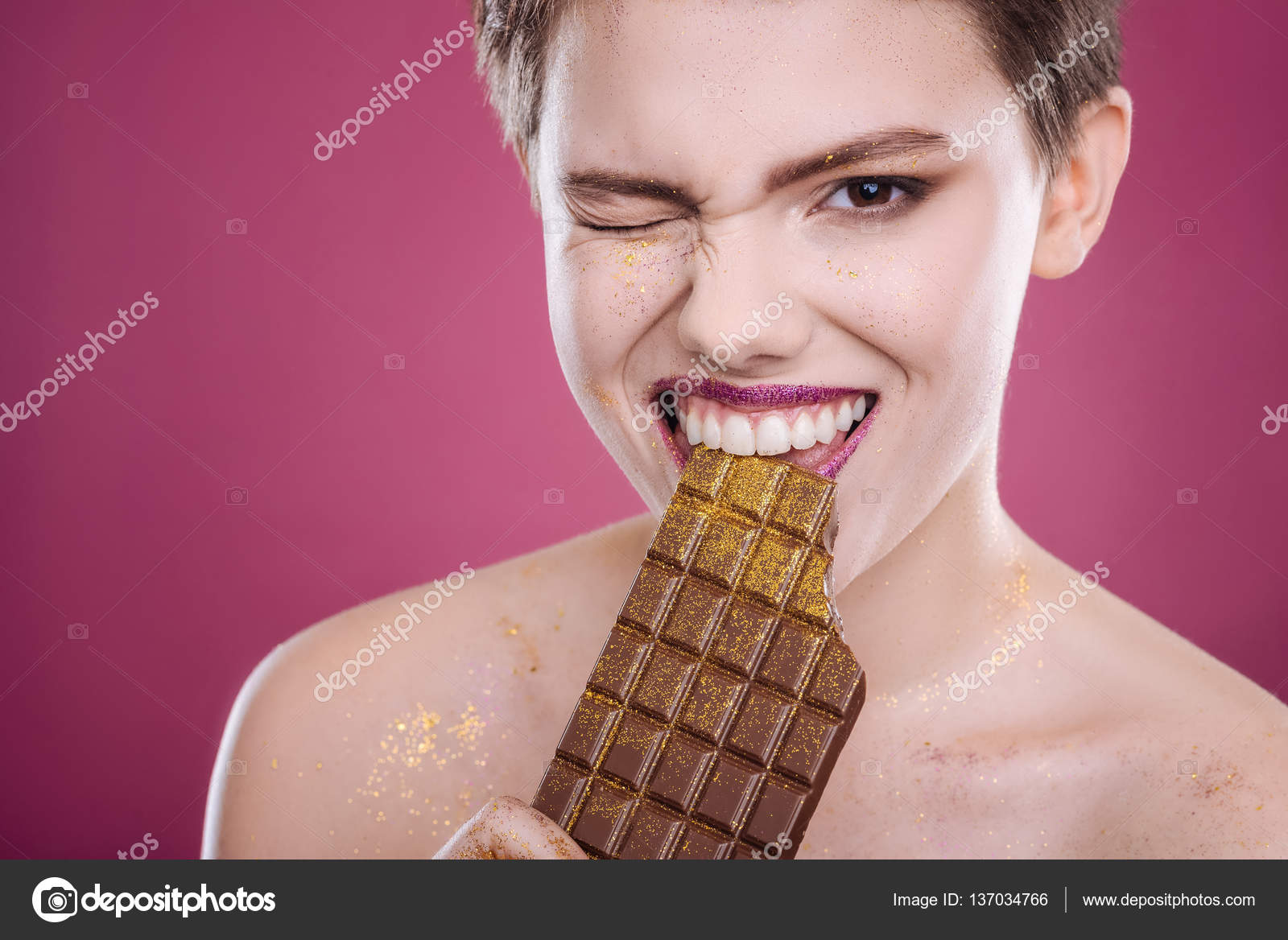 Cheerful delighted woman eating chocolate bar — Stock Photo © Dmyrto_Z ...