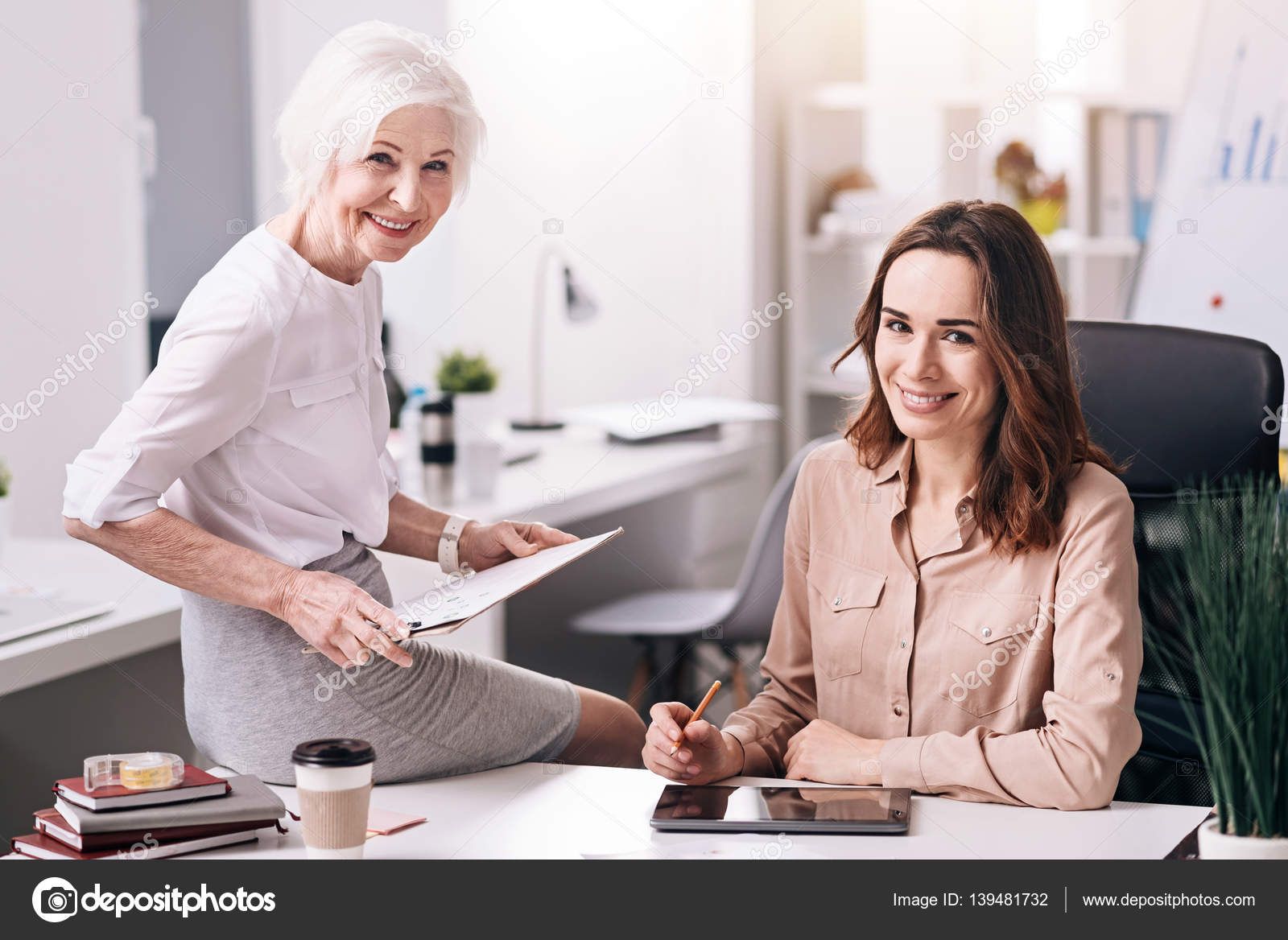 Smiling colleagues working in the office Stock Photo by ©Dmyrto_Z 139481732