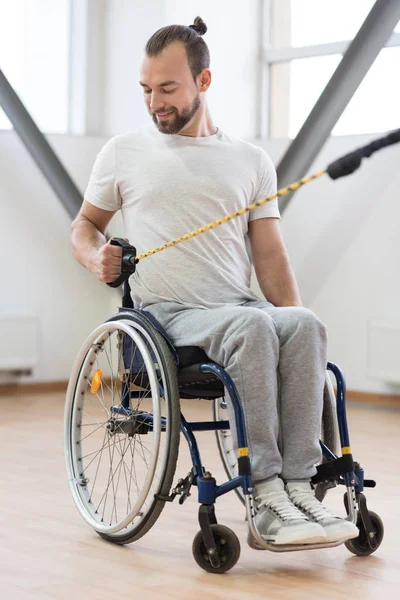 Friendly young disabled working out in the gym - Stock Image - Everypixel