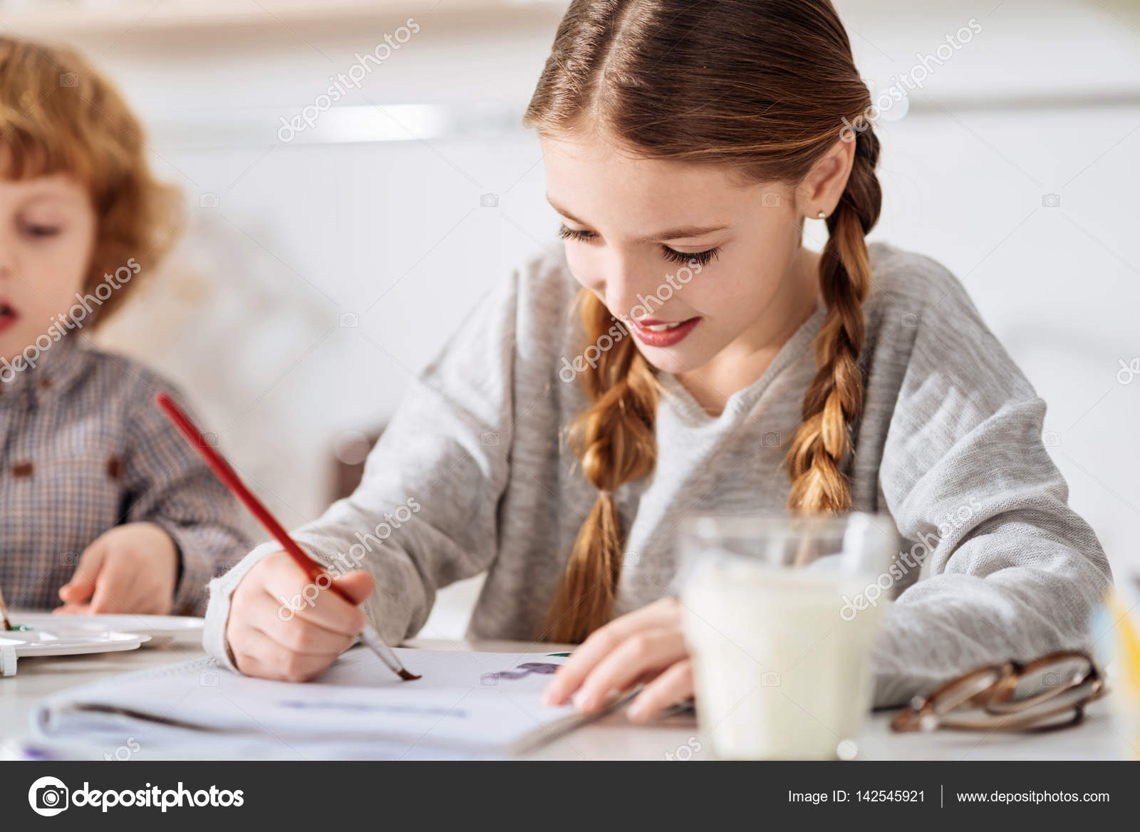 Diligent talented girl doing her art home assignment — Stock Photo ...