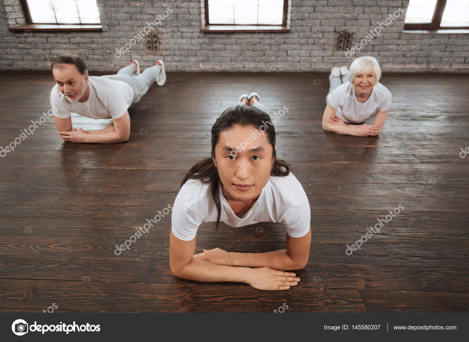 People resting their arms on the parquet Stock Photo by ©Dmyrto_Z 145580207