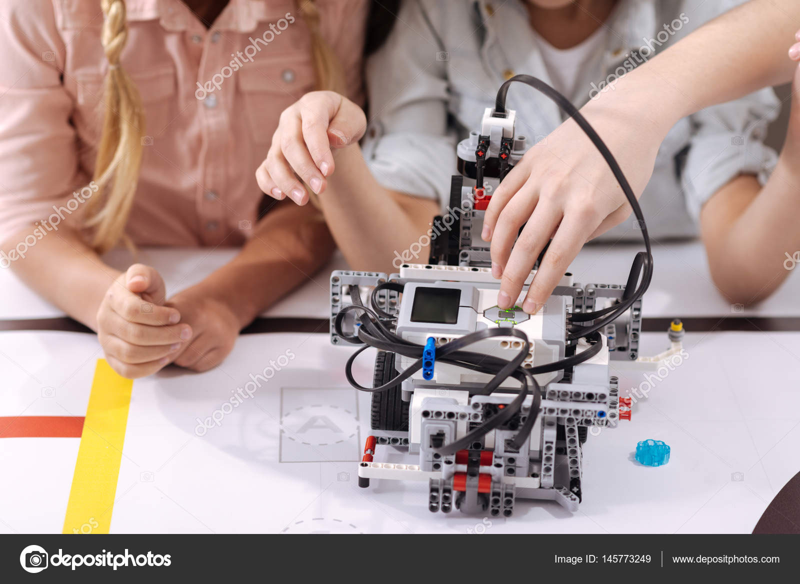 Skillful children testing robot at school — Stock Photo © Dmyrto_Z ...