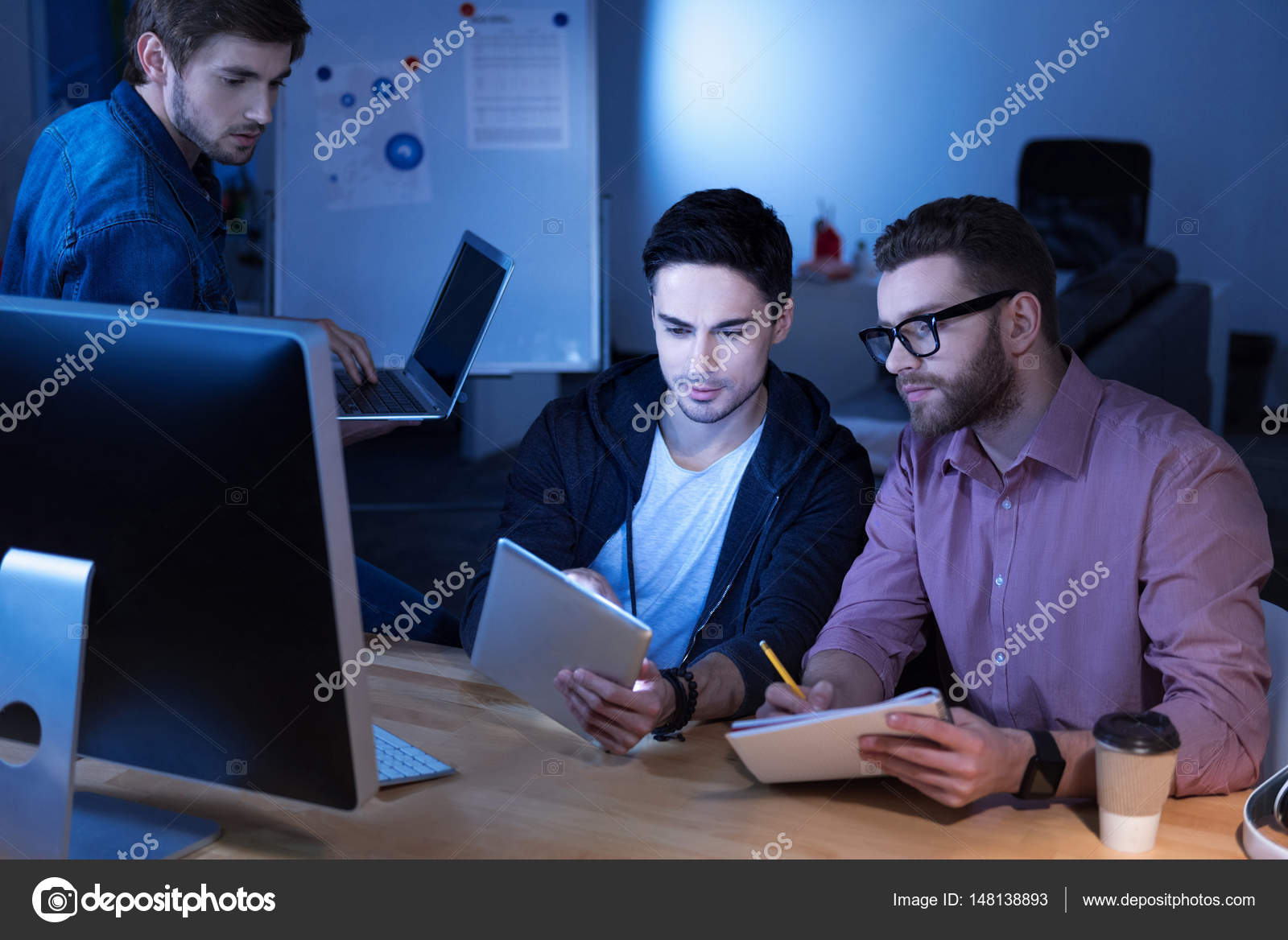Handsome hard working programmer working in team — Stock Photo © Dmyrto ...