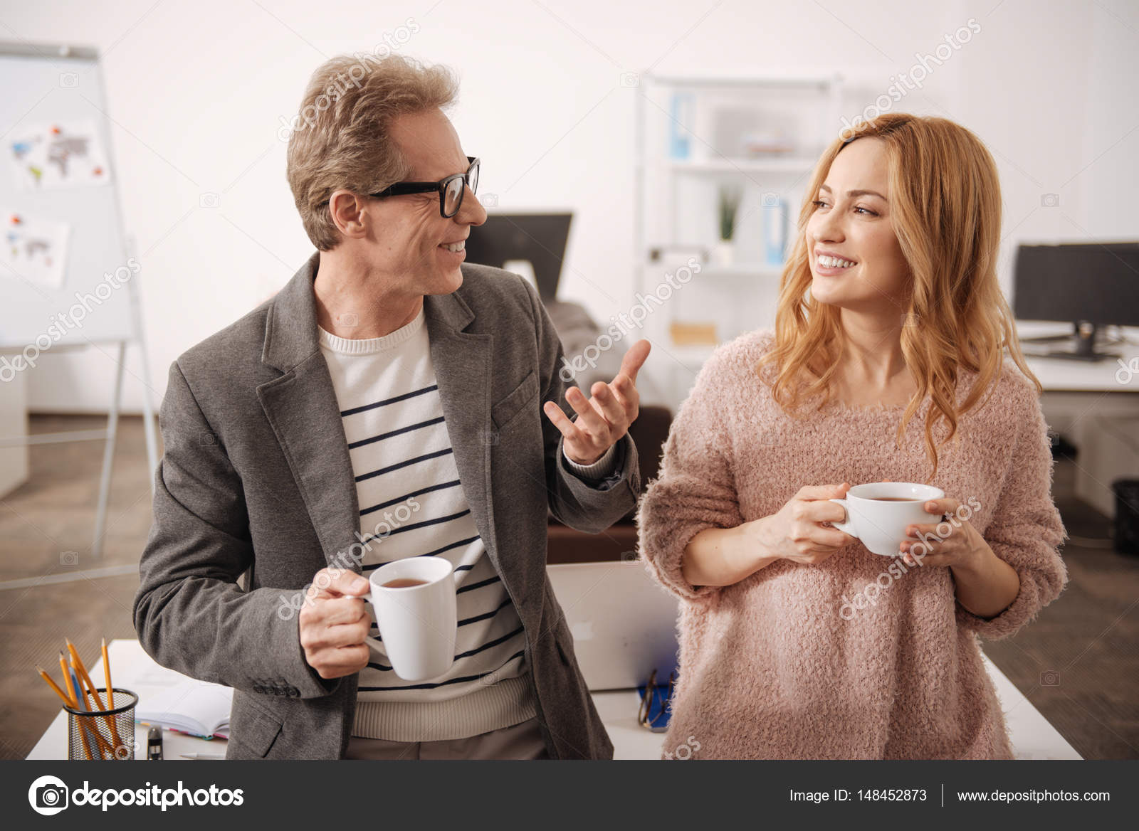 Lively business partners enjoying conversation in the office — Stock ...