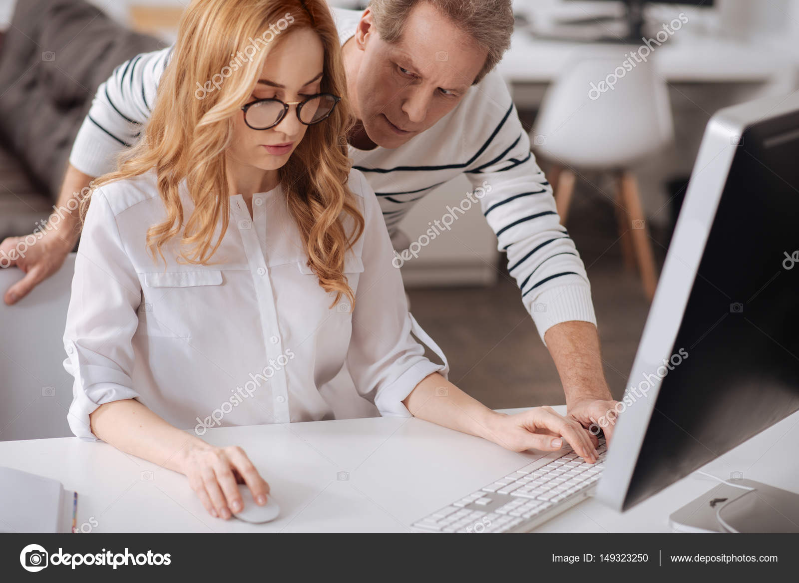 Obsessed mature boss distracting young secretary in the office — Stock ...