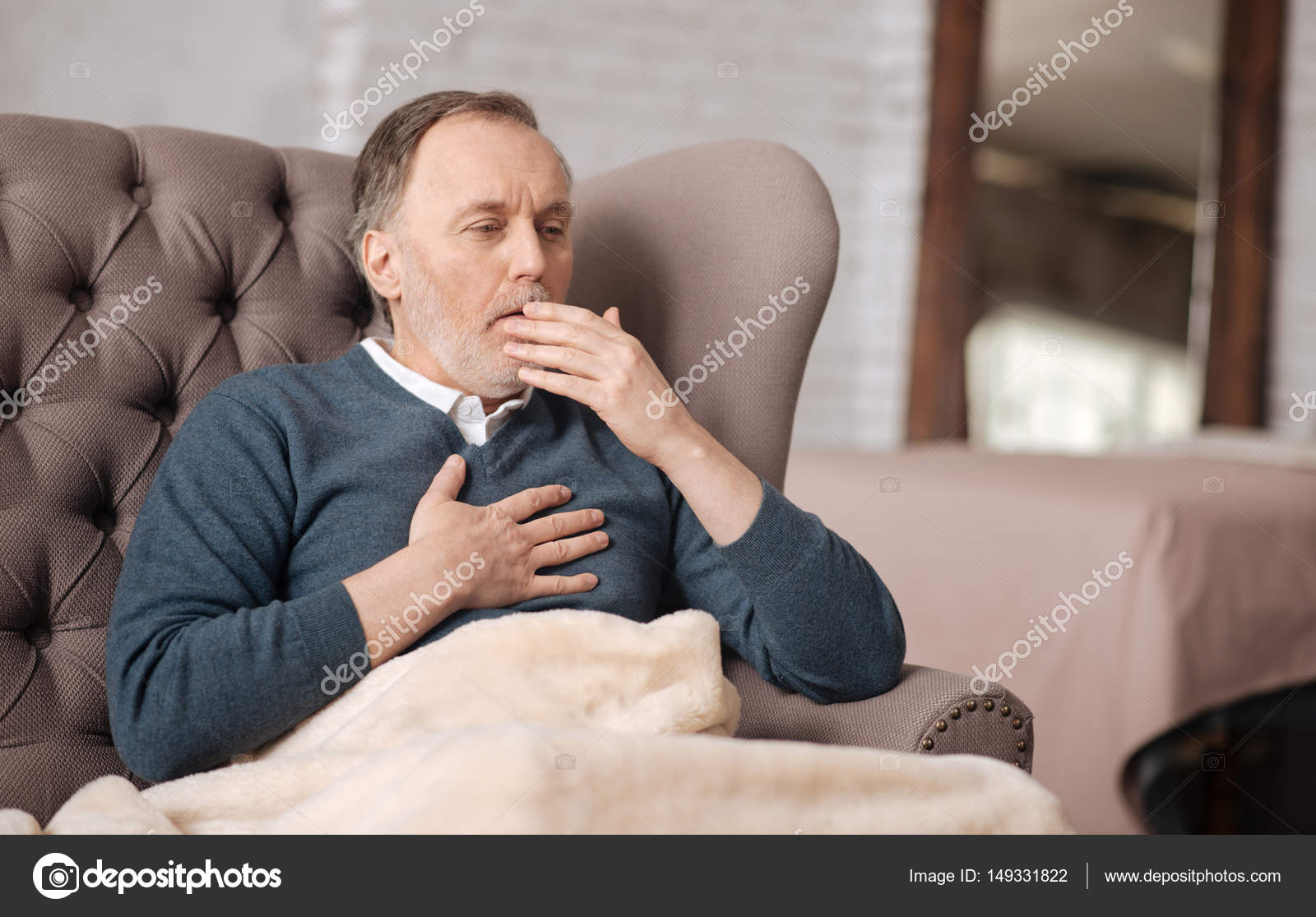 Old man sitting down | Old man sitting on couch and coughing — Stock ...