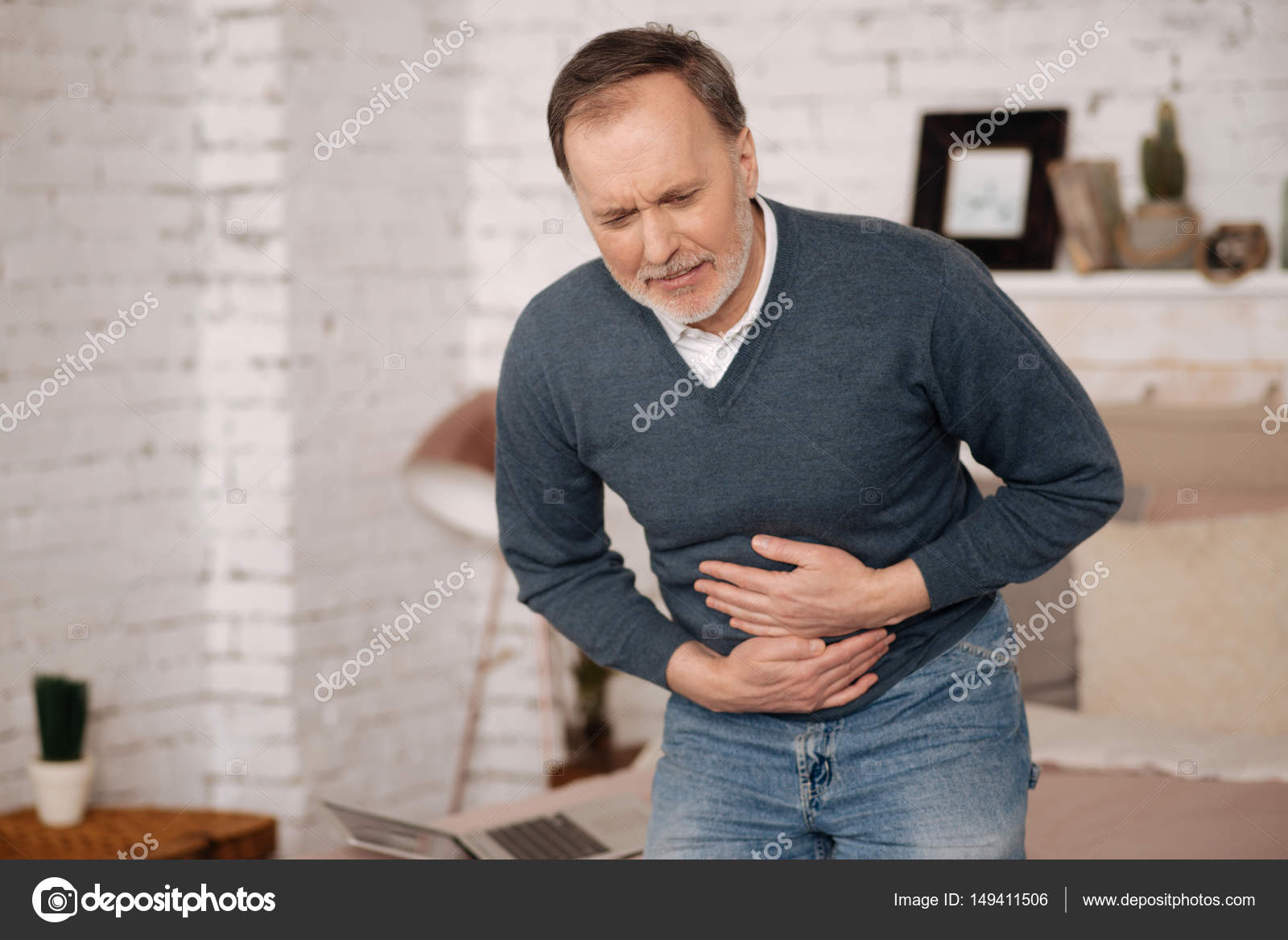 Old man feeling big discomfort in stomach. — Stock Photo © Dmyrto_Z ...