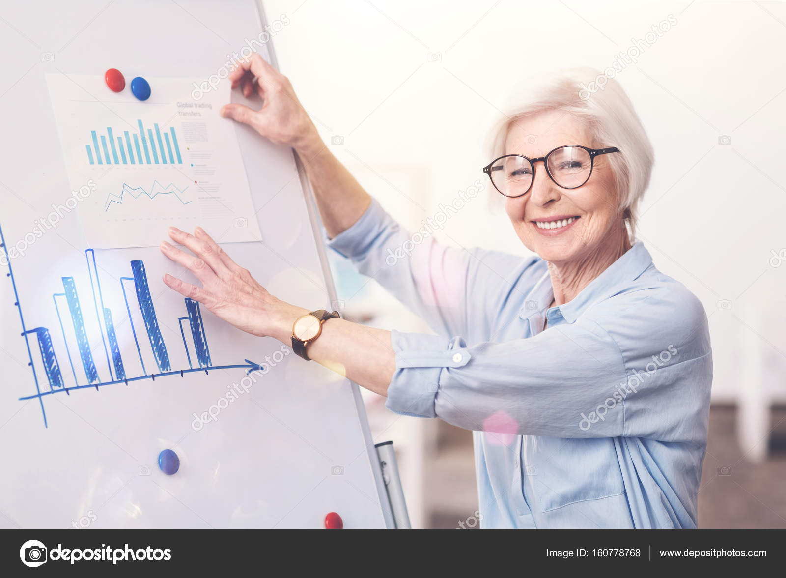 Ambitious senior lady creating a presentation — Stock Photo © Dmyrto_Z ...