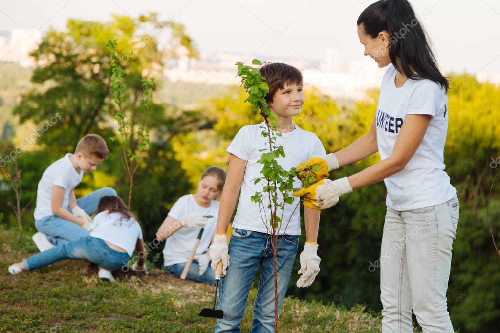 Little volunteer speaking with his friend — Stock Photo © Dmyrto_Z ...
