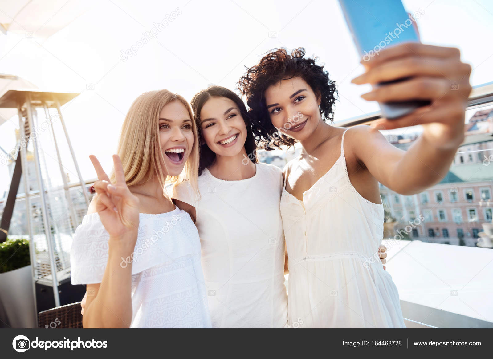 Happy joyful women posing for a photo Stock Photo by ©Dmyrto_Z 164468728