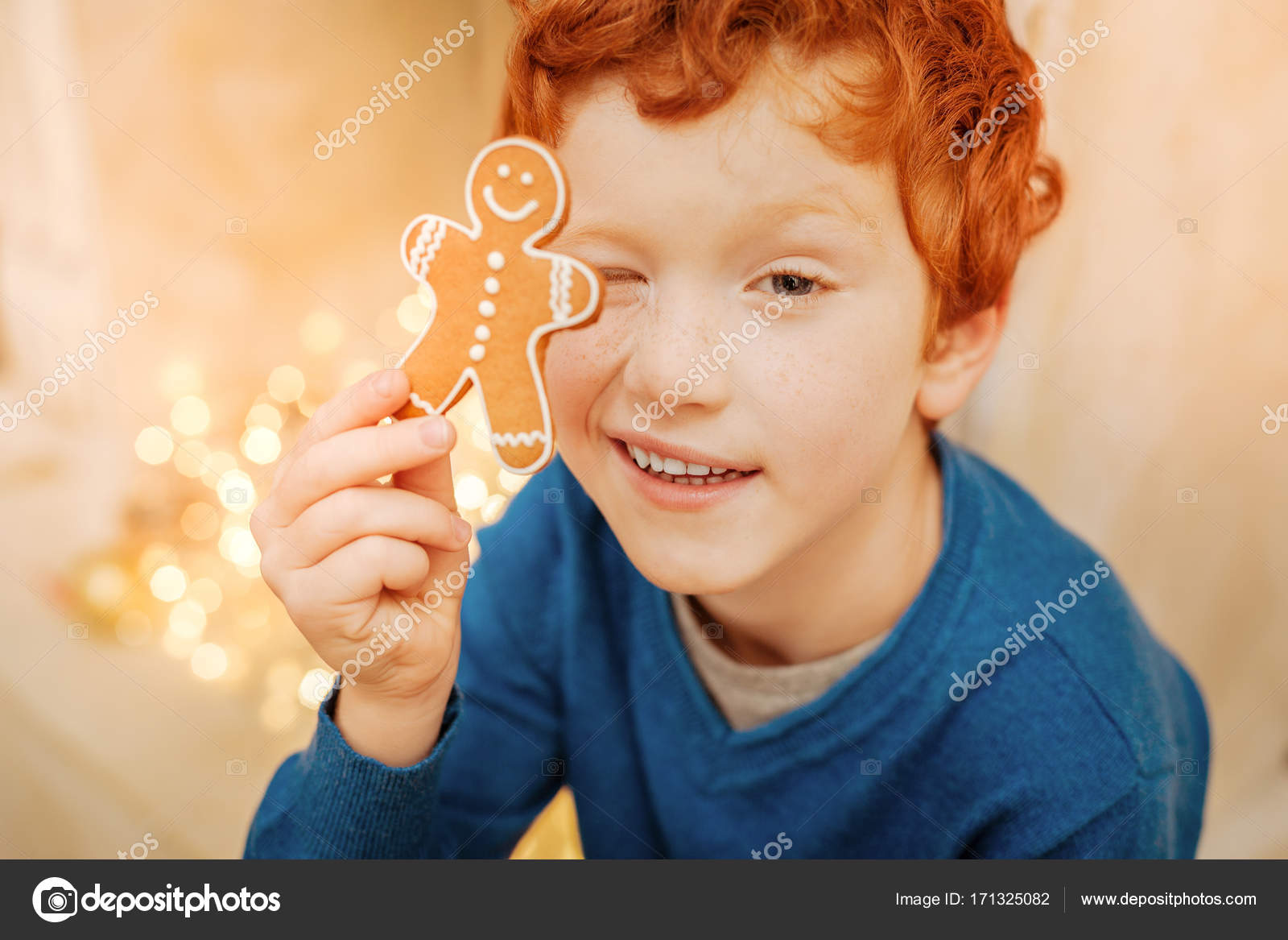 Charming little boy joking and hiding behind gingerbread man — Stock ...