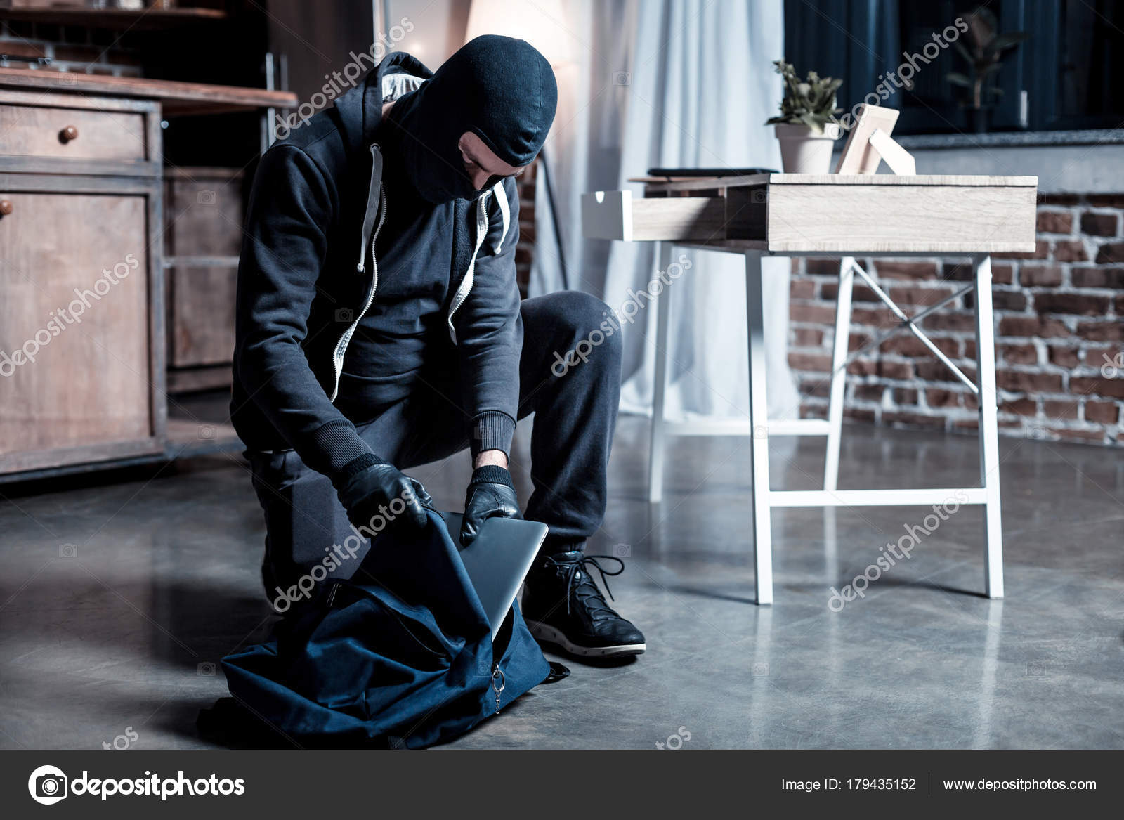Professional robber stealing a modern laptop — Stock Photo © Dmyrto_Z ...