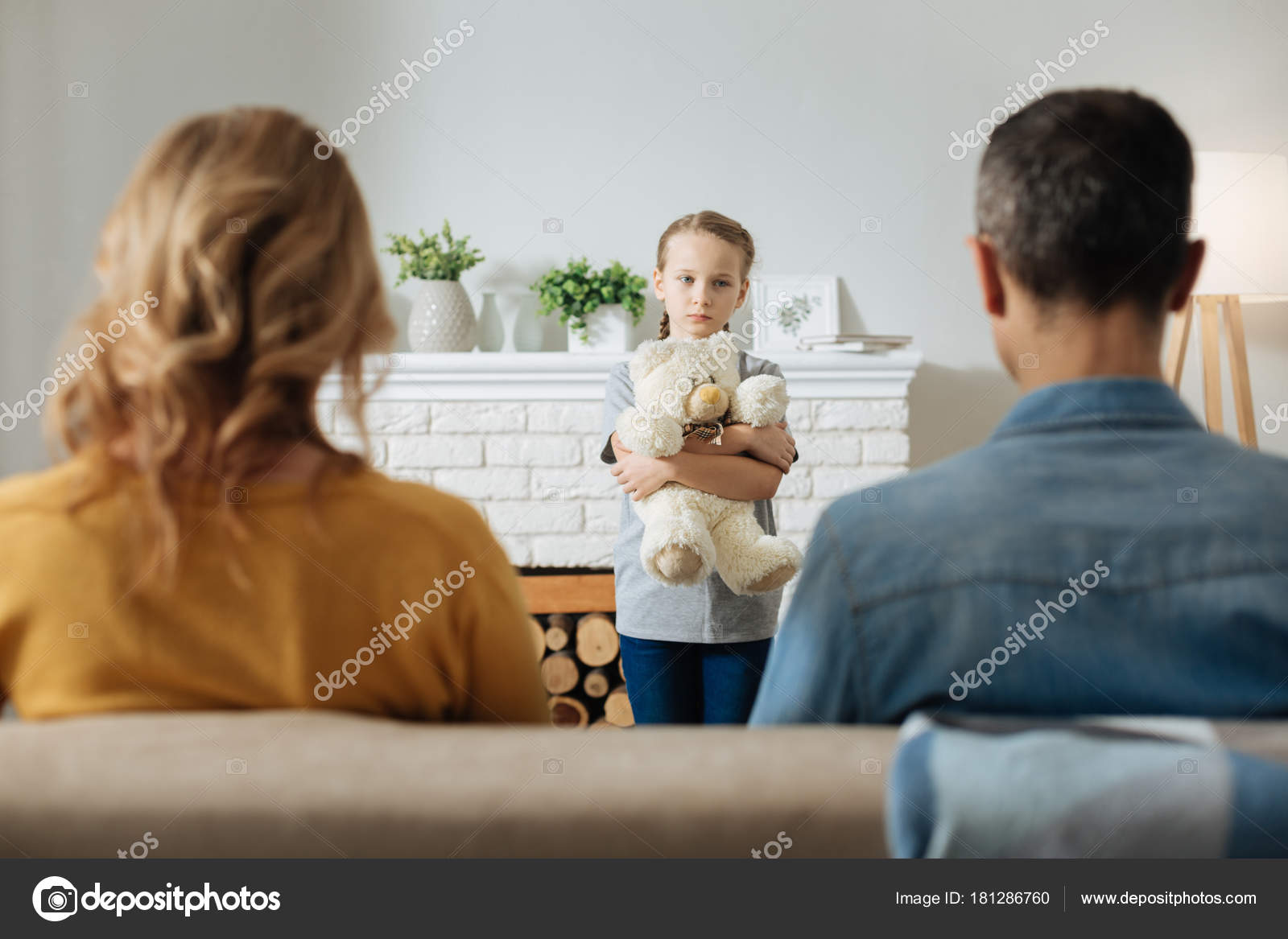 Sad child standing in front of her parents — Stock Photo © Dmyrto_Z ...