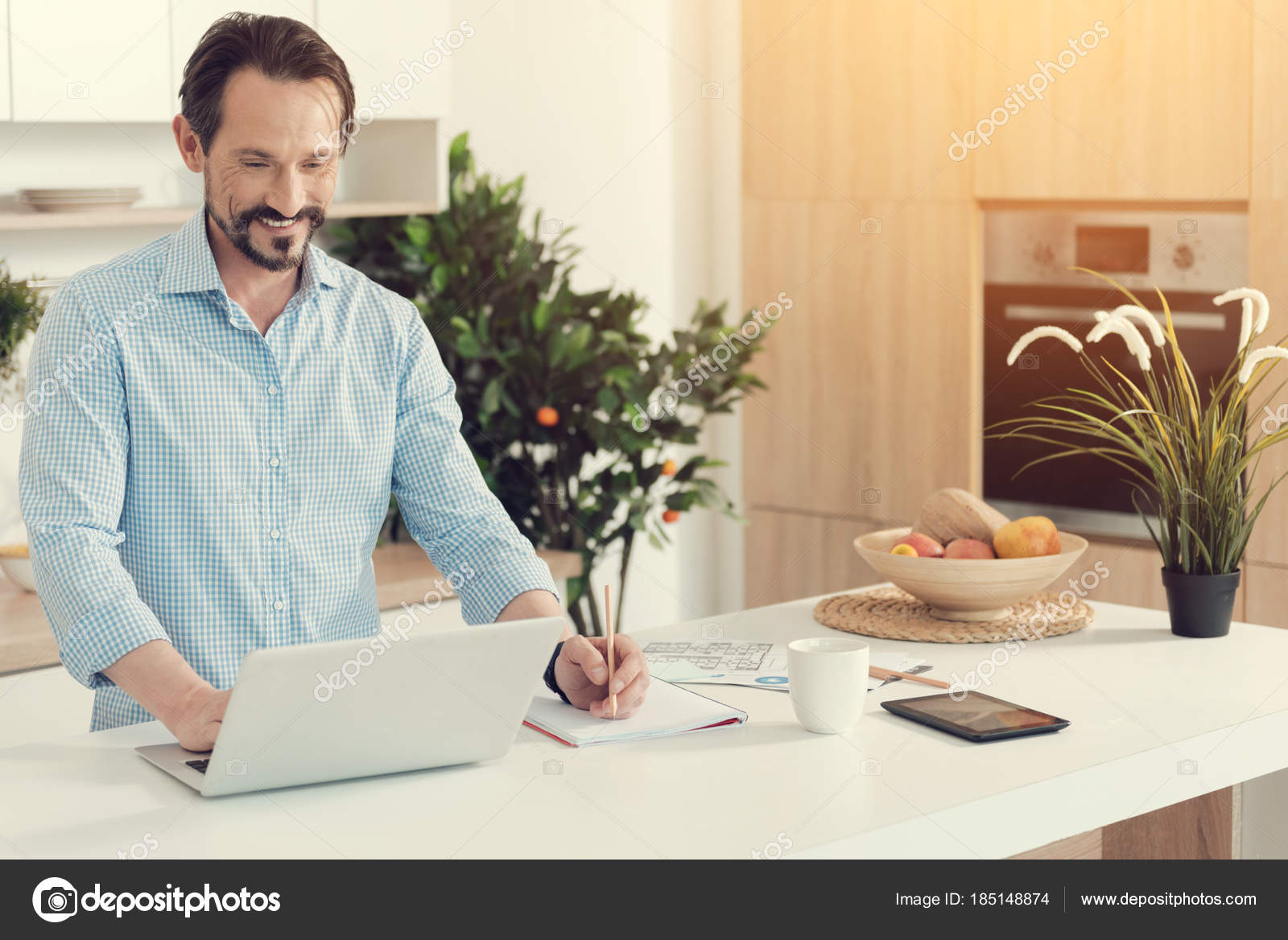 Delighted happy man taking notes Stock Photo by ©Dmyrto_Z 185148874