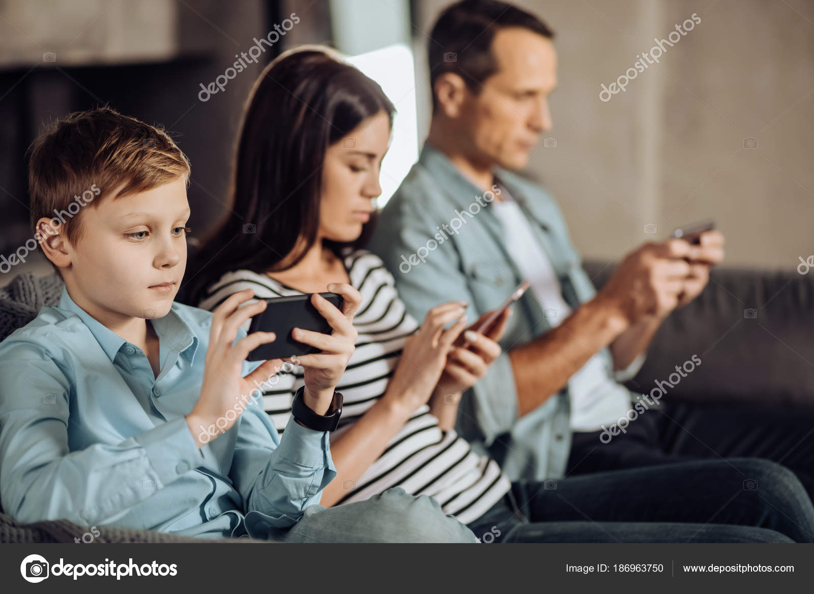 Little boy and his parents using their phones — Stock Photo © Dmyrto_Z ...