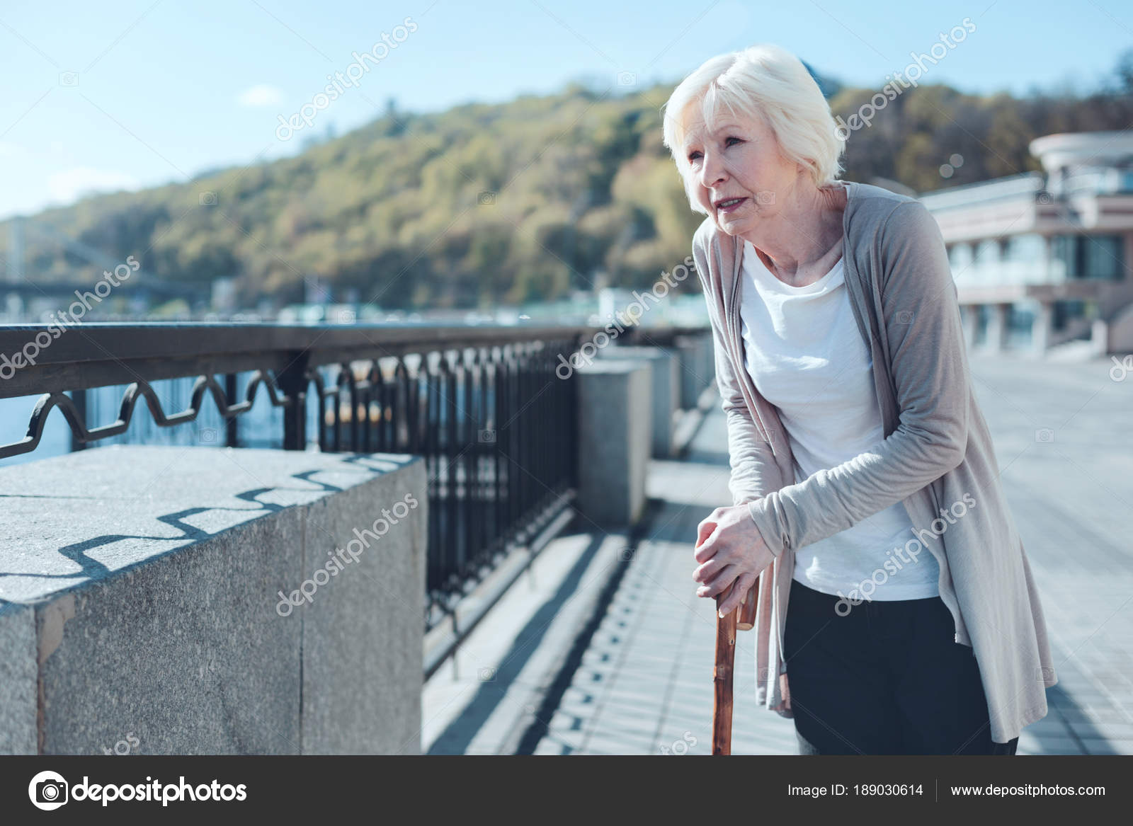 Ill elderly lady promenading along the riverwalk Stock Photo by ©Dmyrto ...