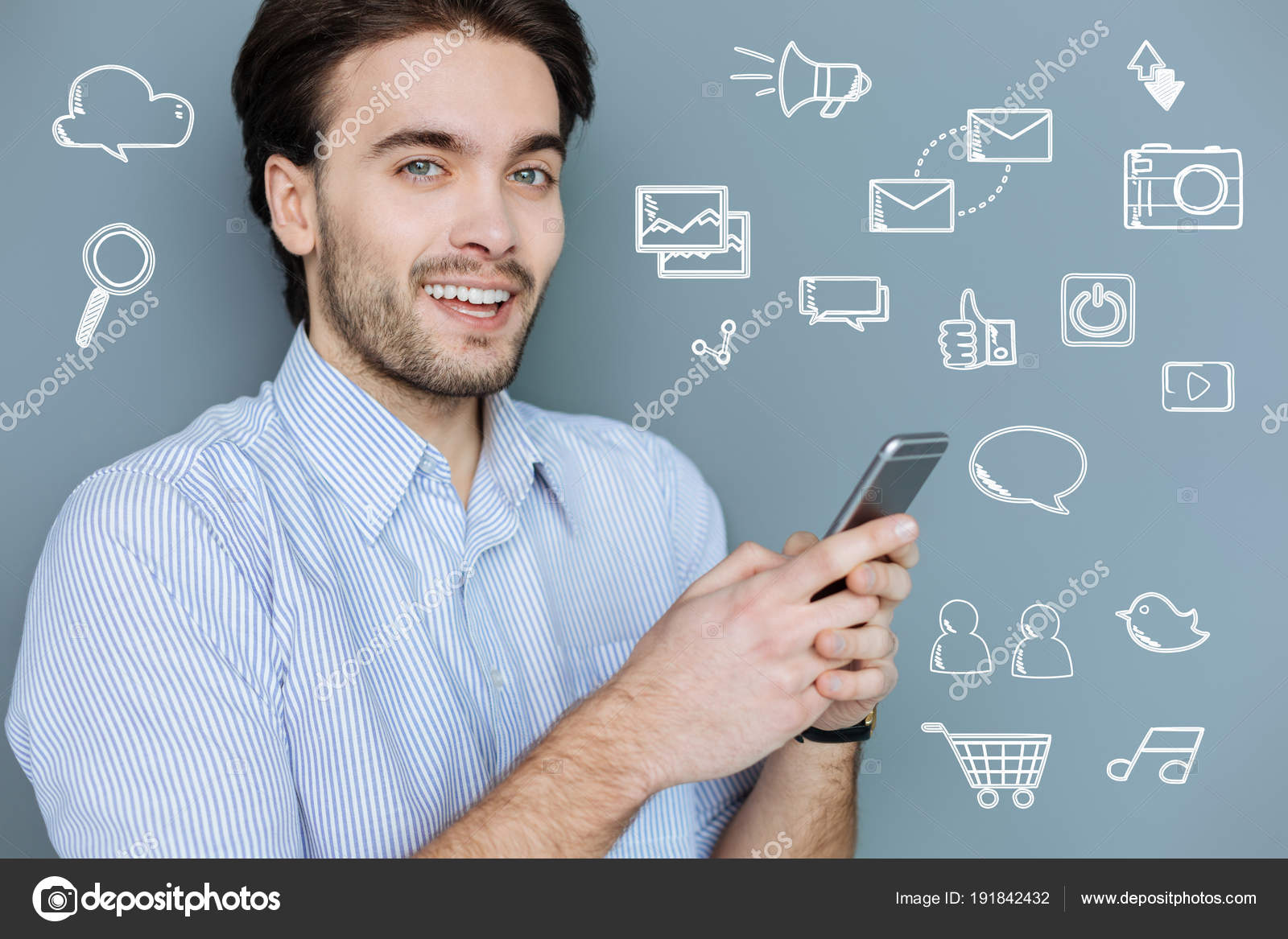 Young teacher typing messages to his students and smiling — Stock Photo ... Young teacher typing messages to his students and smiling — Stock Photo ...