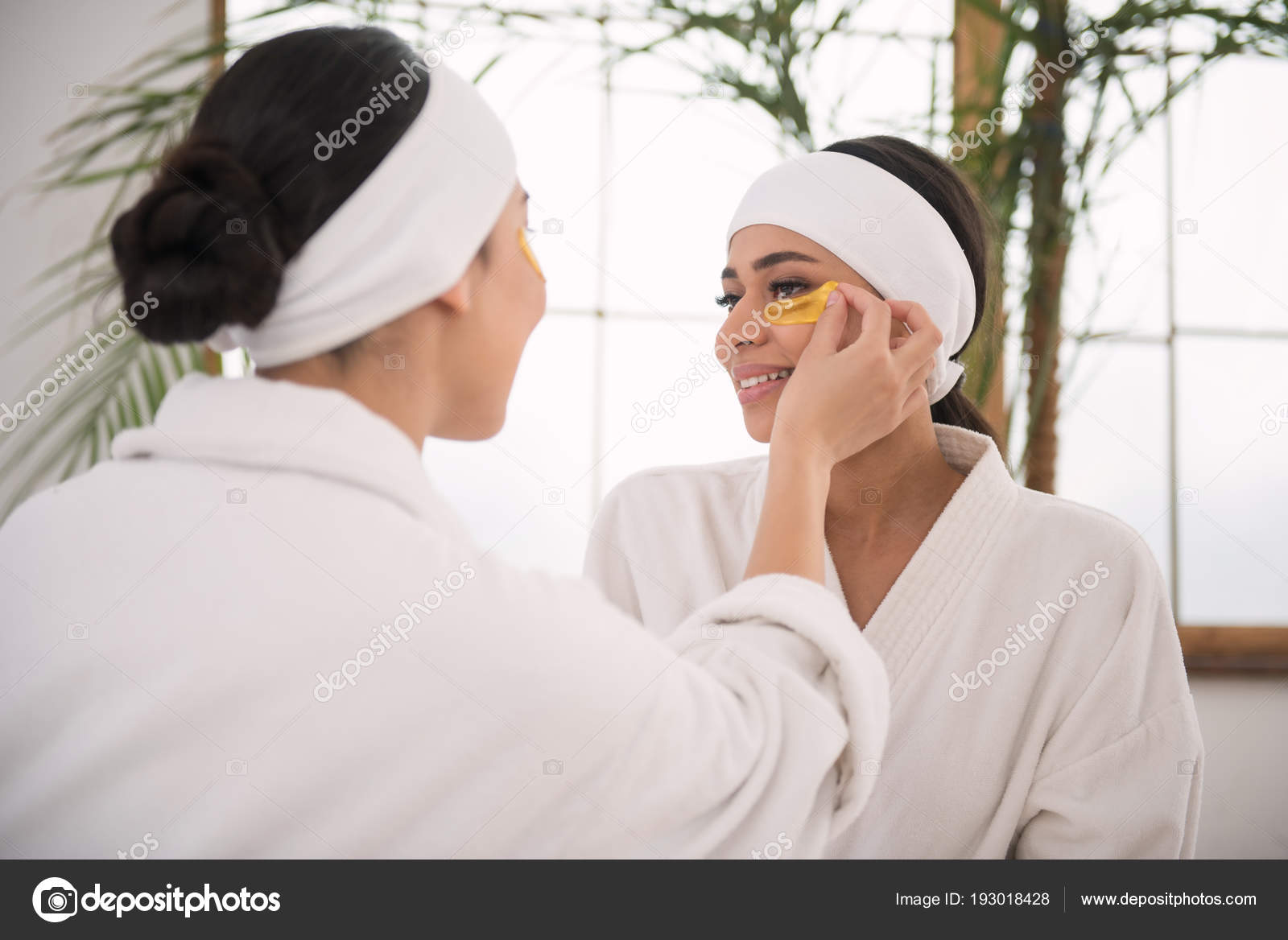 Nice delighted women helping each other — Stock Photo © Dmyrto_Z #193018428
