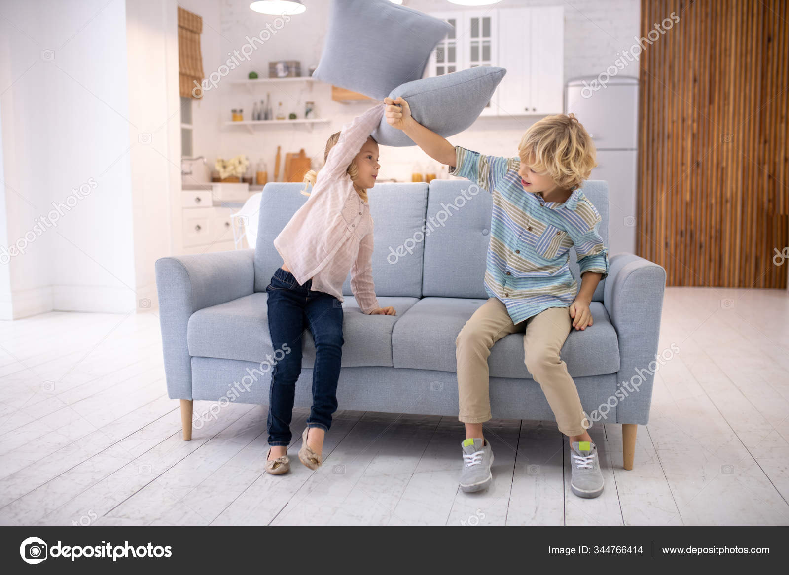 Two kids beating each other with pillows and feeling angry — Stock ...