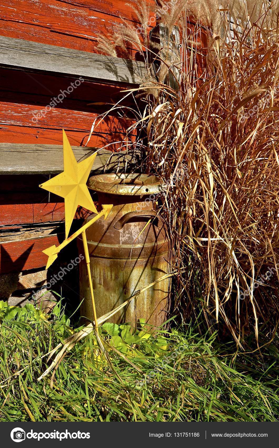 Old cream can in front of barn — Stock Photo © fiskness #131751186