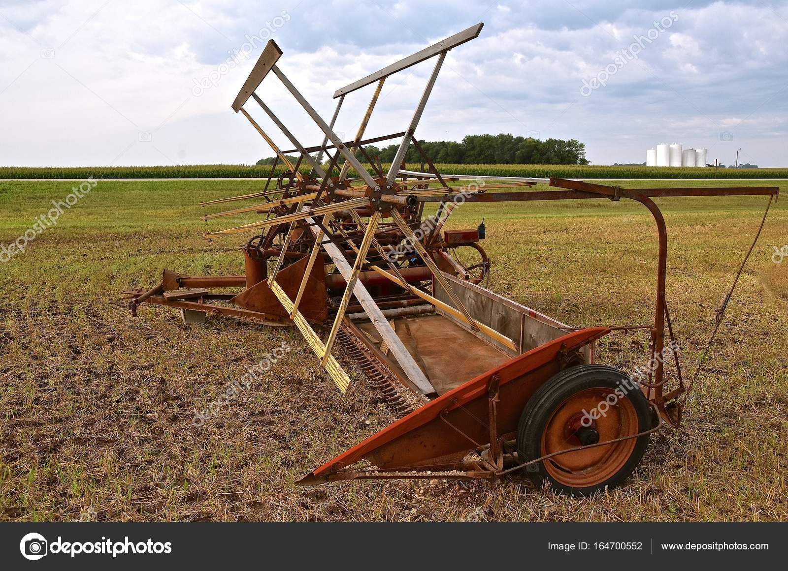 Old vintage grain swather parked in a wheat stubble field — Stock Photo ...
