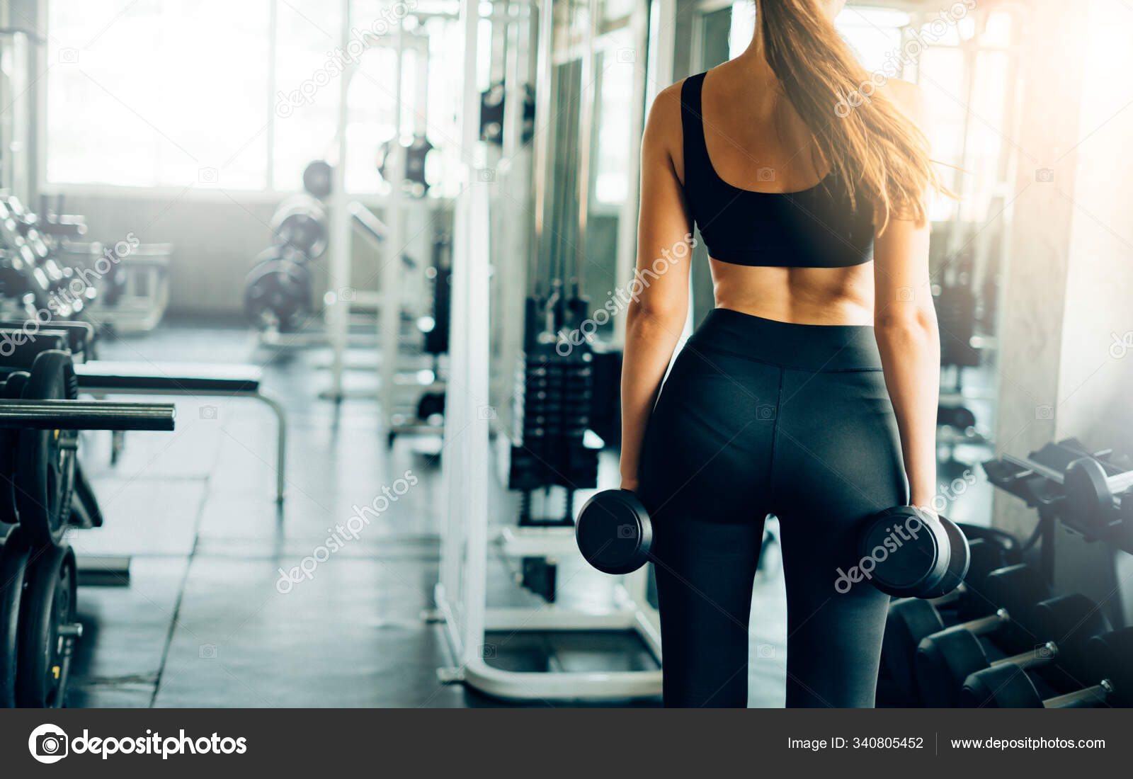 Young Girl Playing Dumbbell Exercise Fitness Slim Girl Lifts Heavy ...