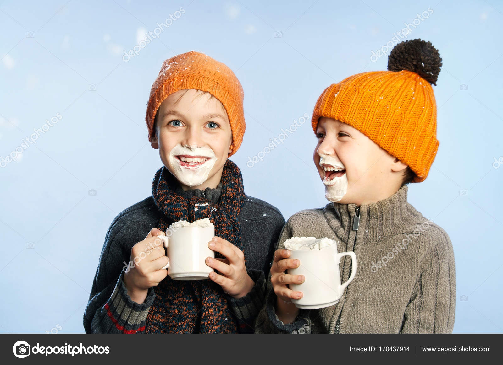 Small Series of two Bothers with orange hats in Winter Snow Background ...