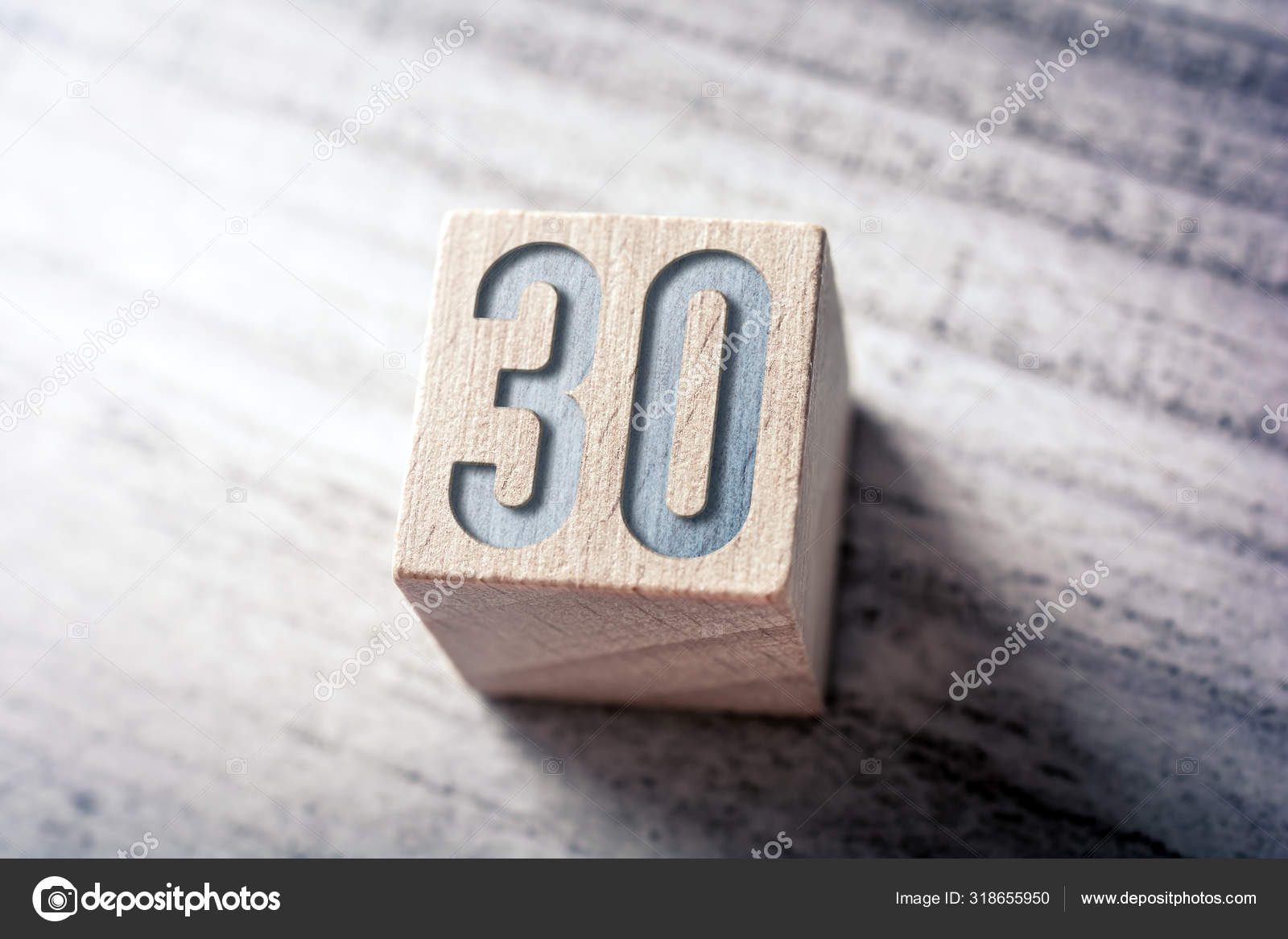 Number 30 On A Wooden Block On A Table — Stock Photo © Bain #318655950