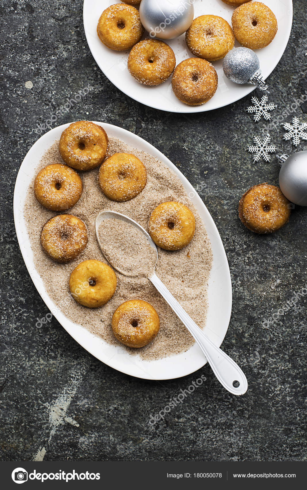 Appetizing ruddy traditional donuts with sugar and cinnamon on an oval ...