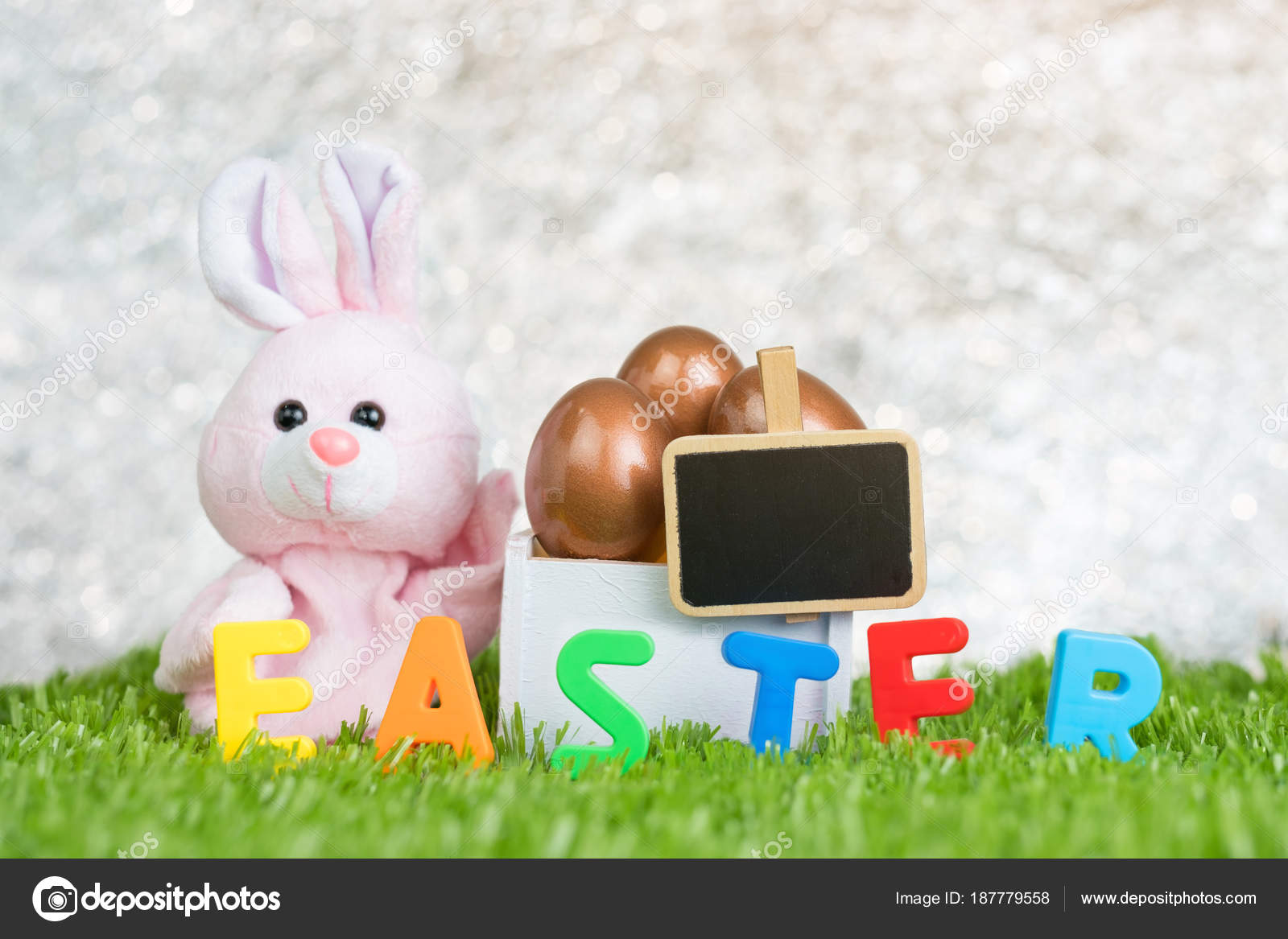 Pink rabbit and rose gold easter egg in wood white box and blank Stock ...