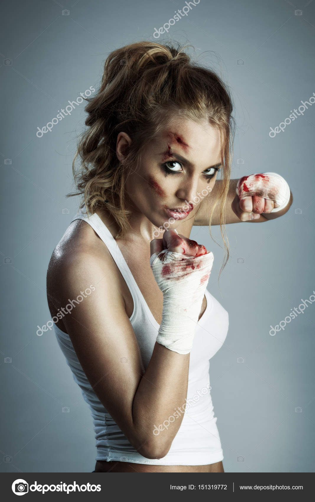 Aggressive female fighter Stock Photo by ©fisher.photostudio 151319772