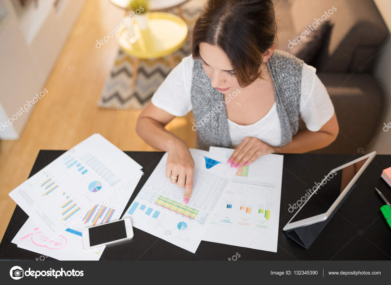 Studying statistic graphs Stock Photo by ©InnerVisionPRO 132345390