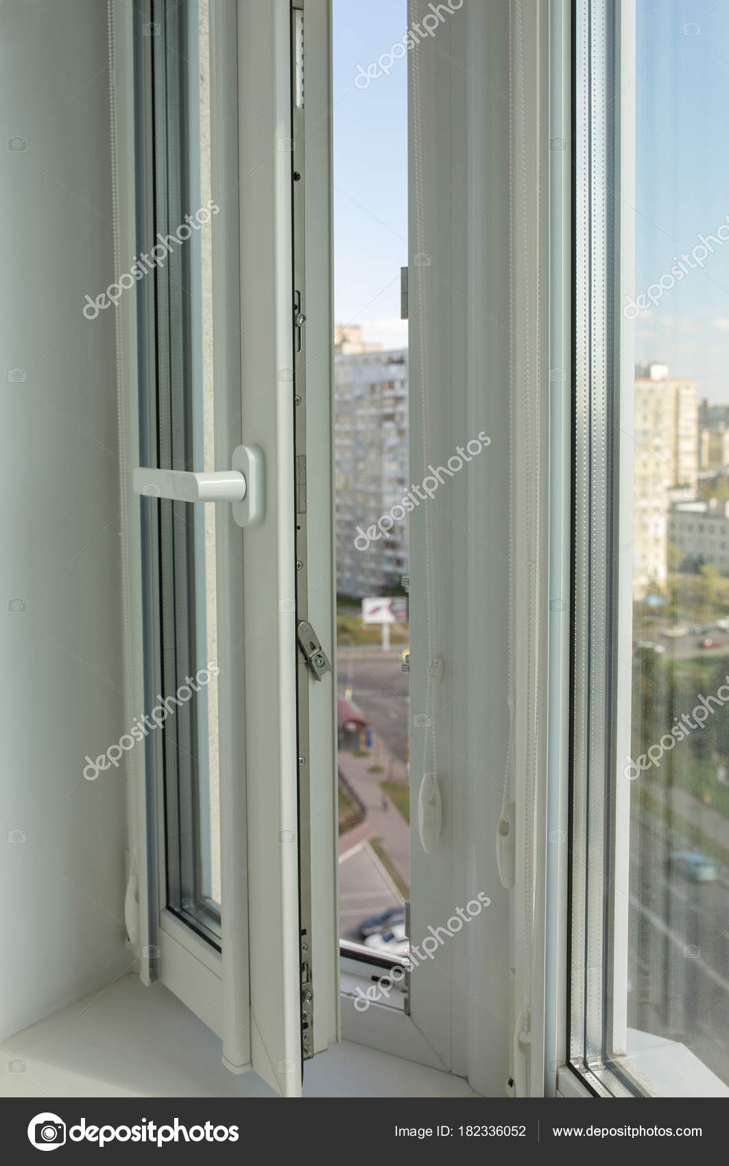 Open pvc window on the background of multi-storey apartment buil Stock ...