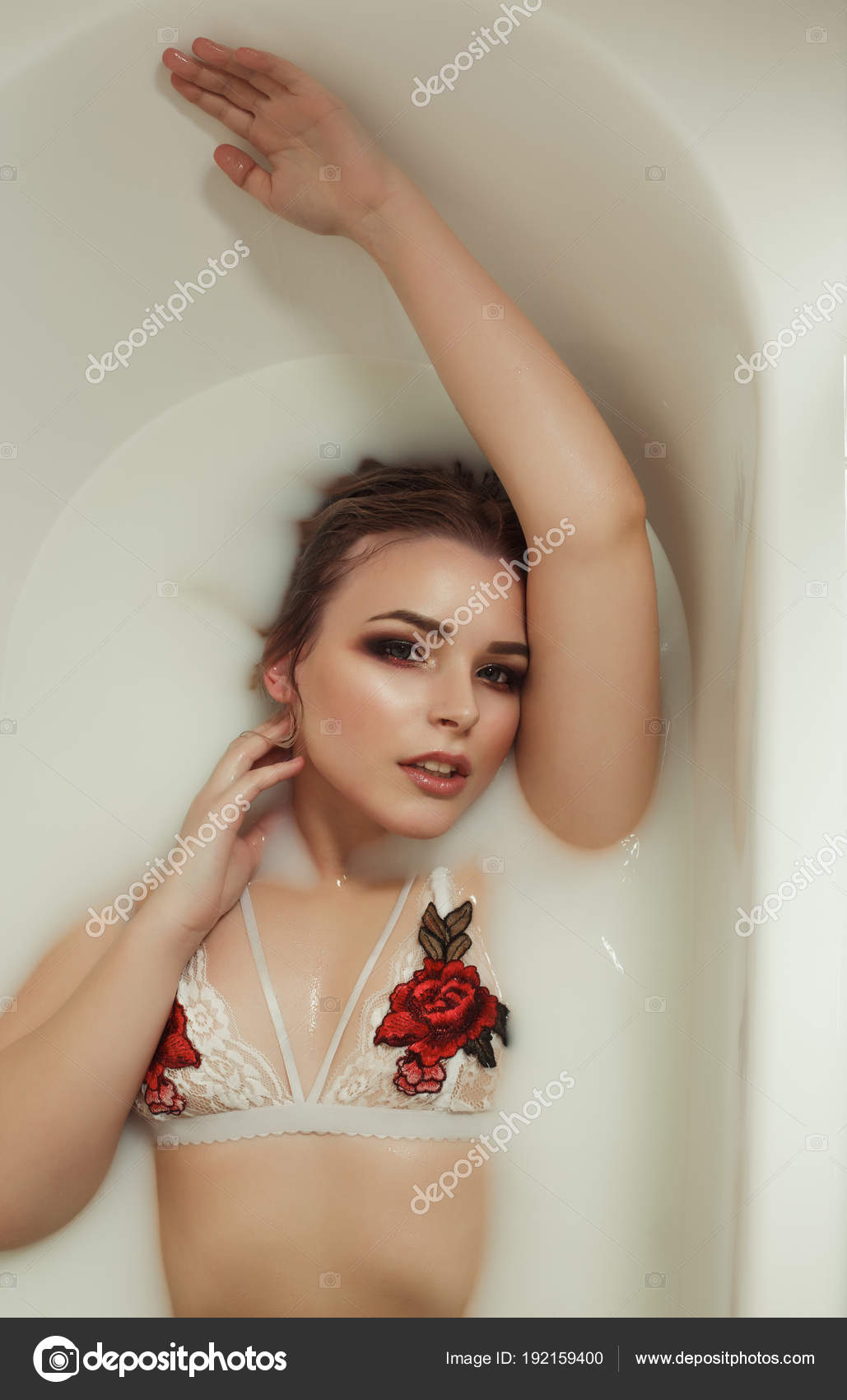 Lovely young woman in lace lingerie with embroidery takes a bath — Stock Photo © vika-pavlyuk ...