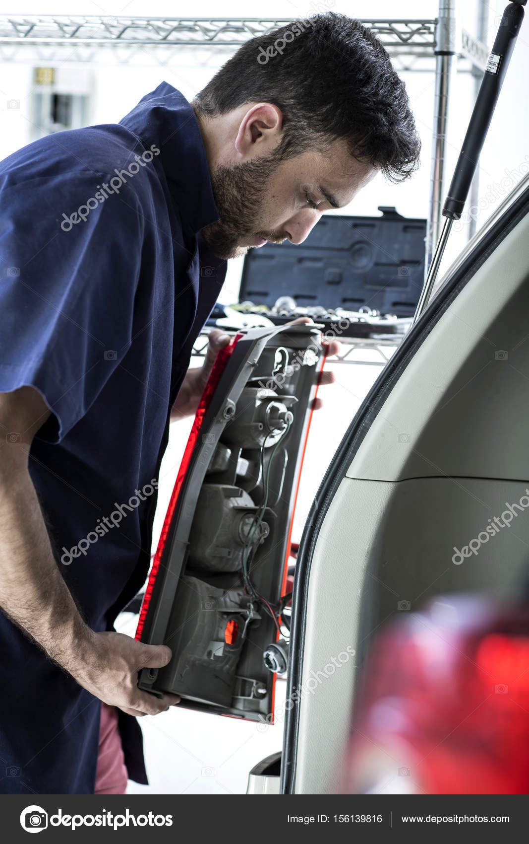 Car Mechanic Man Garage Fixing Engine — Stock Photo © camaralenta ...