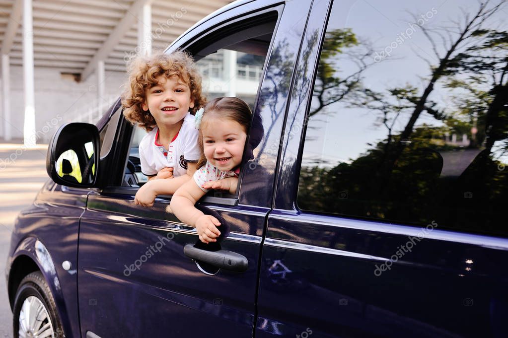 Children look out from a car window Stock Photo by ©Kalinovskiy 129036836
