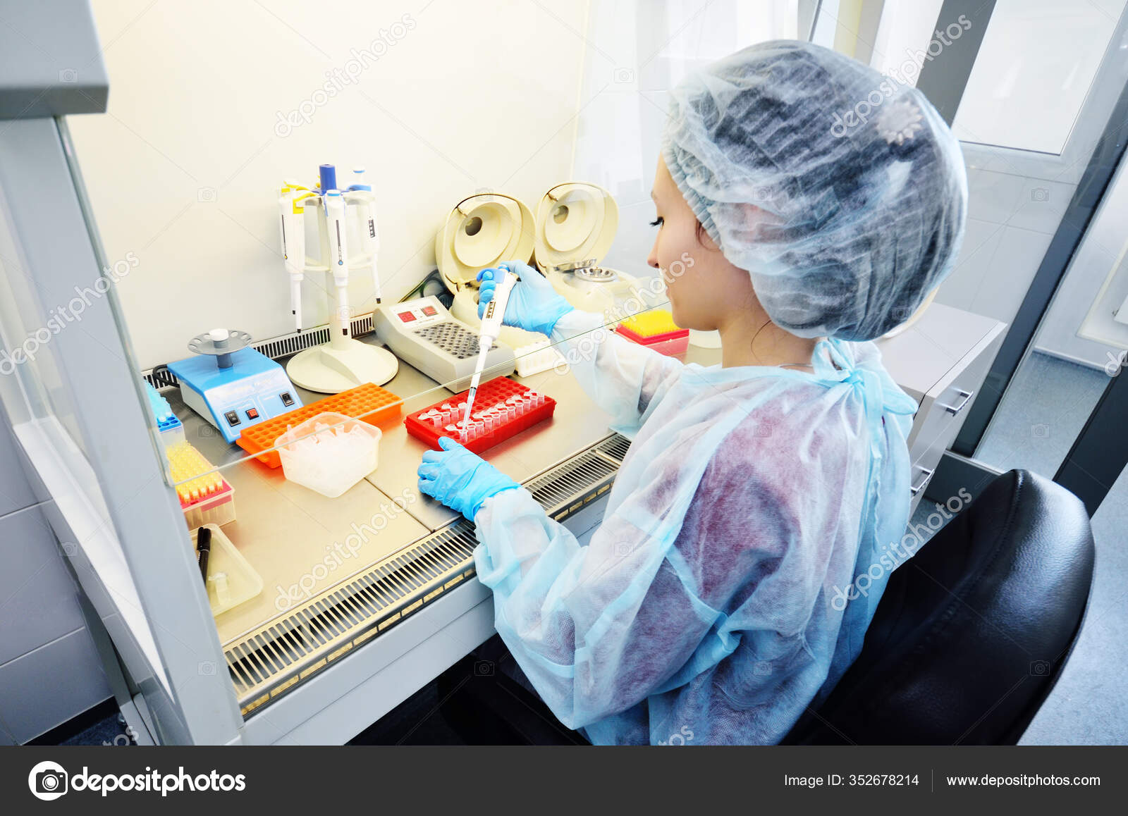 Female scientist makes PCR DNA tests in a modern chemical and ...