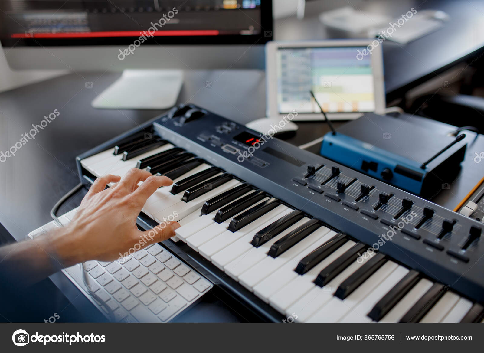 Composer hands on piano keys in recording studio. music production ...