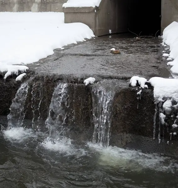 Water stream flowing out the underground tunnel — Stock Photo ...