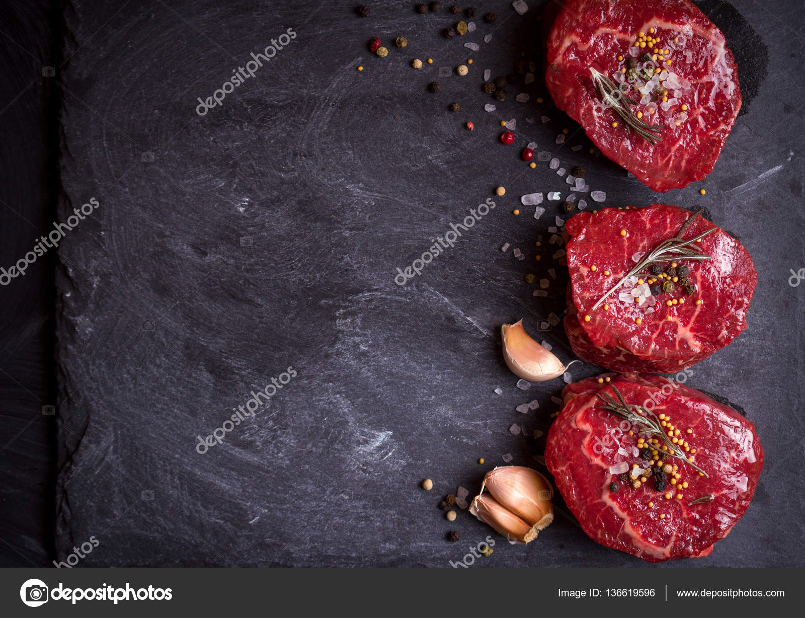 Raw filet mignon steaks with spices — Stock Photo © somegirl #136619596
