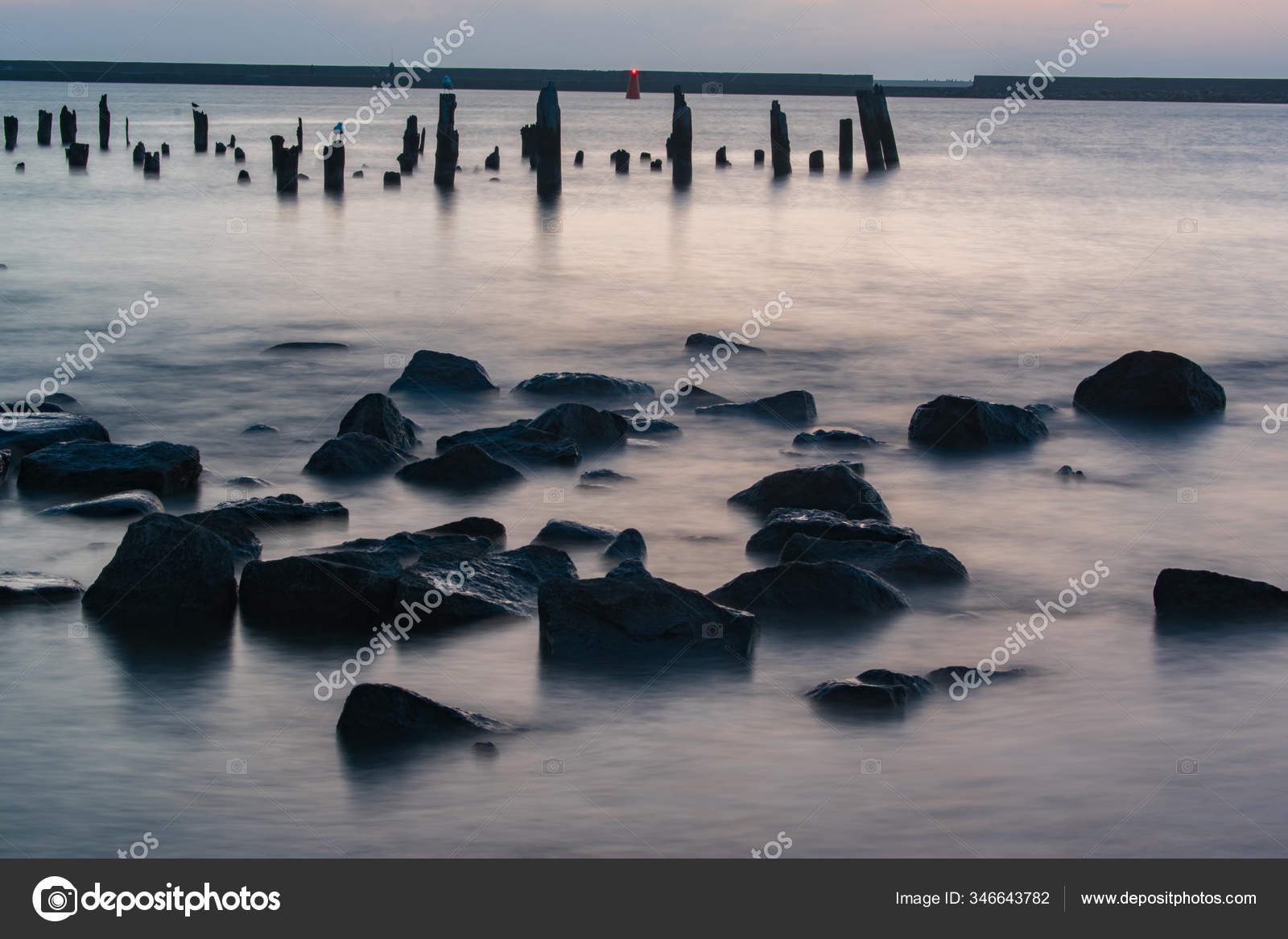 Beautiful Long Exposure Beach Landscape Rocks Remains Poles Water ...