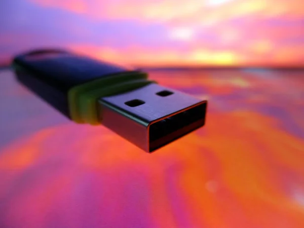 USB flash drive is on the monitor screen - Stock Image - Everypixel
